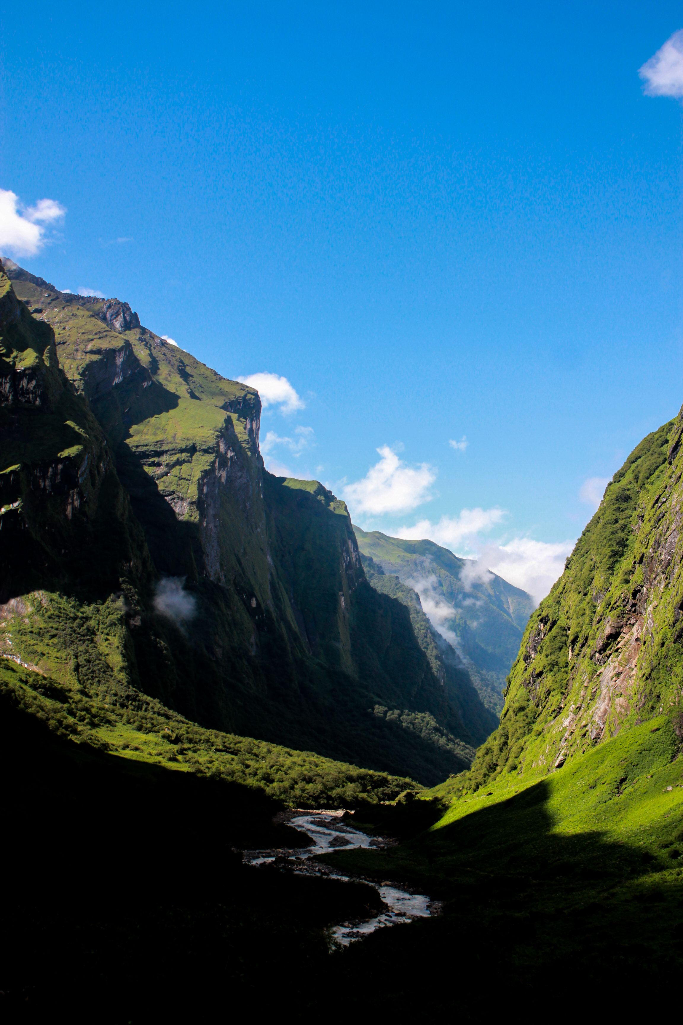Valley between Green Mountains under Blue Sky · Free Stock Photo