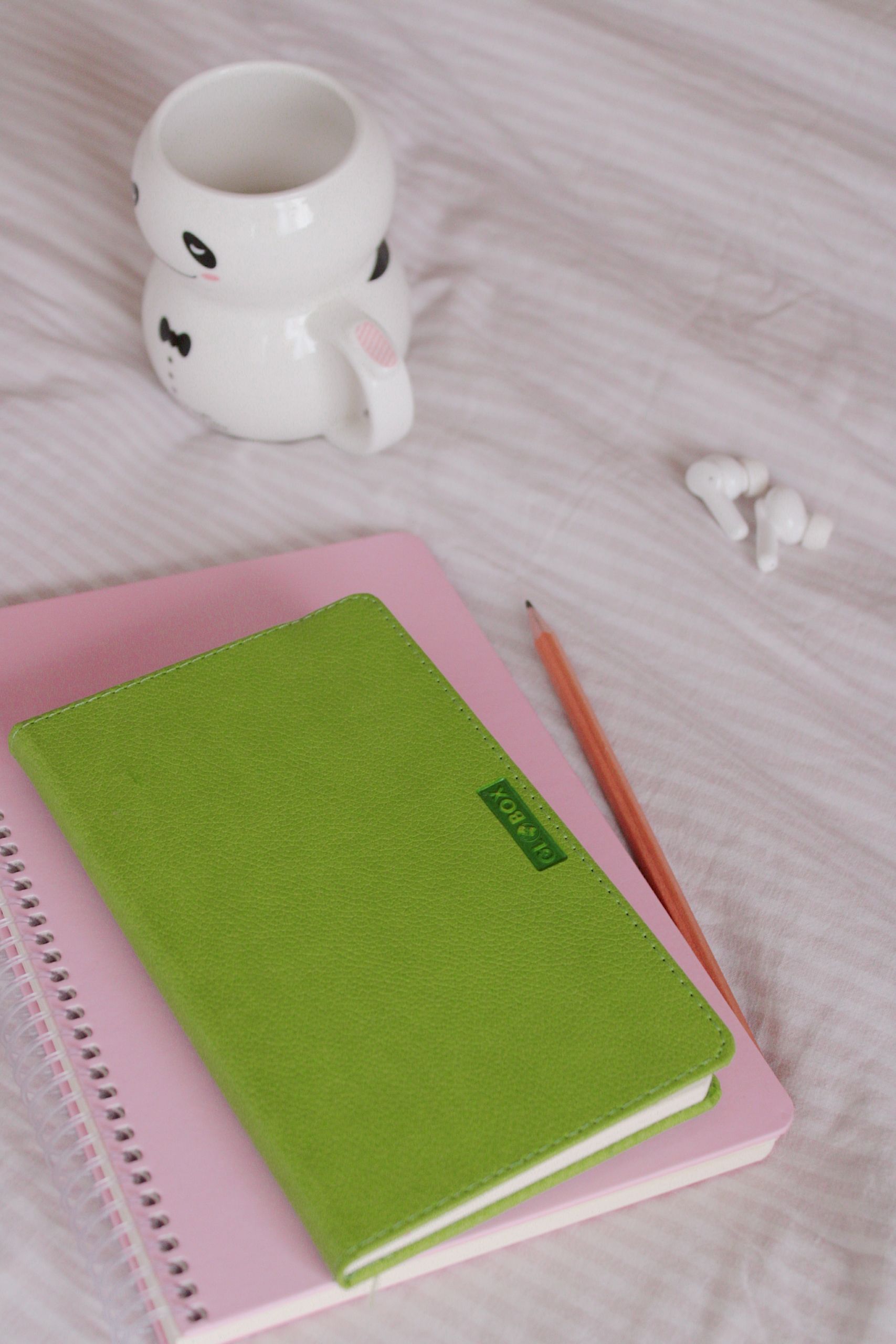 A Yellow Pencil in Between the Pages of a Notebook · Free Stock Photo