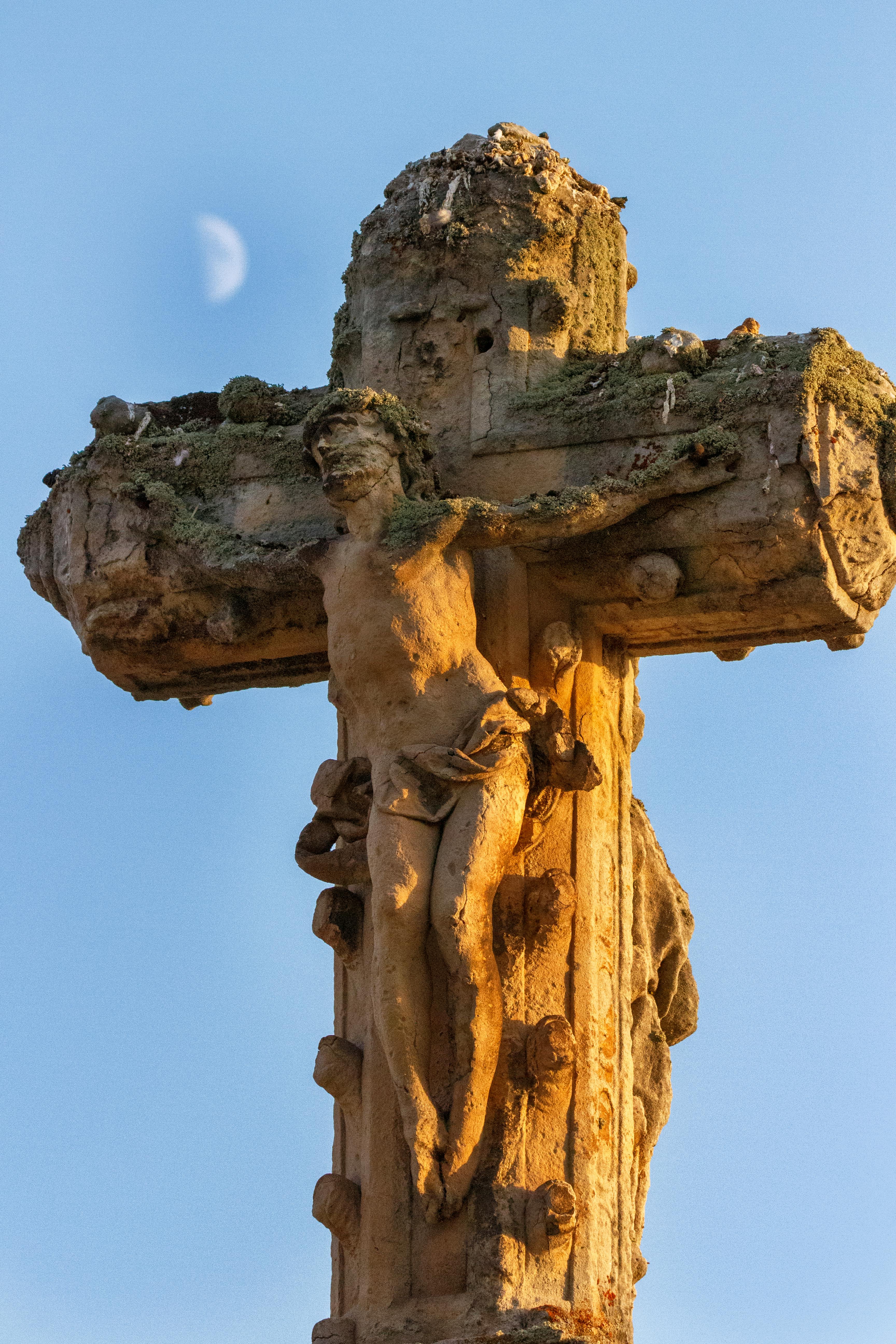 Man Standing on Stair Under Cross Statue Background · Free Stock Photo