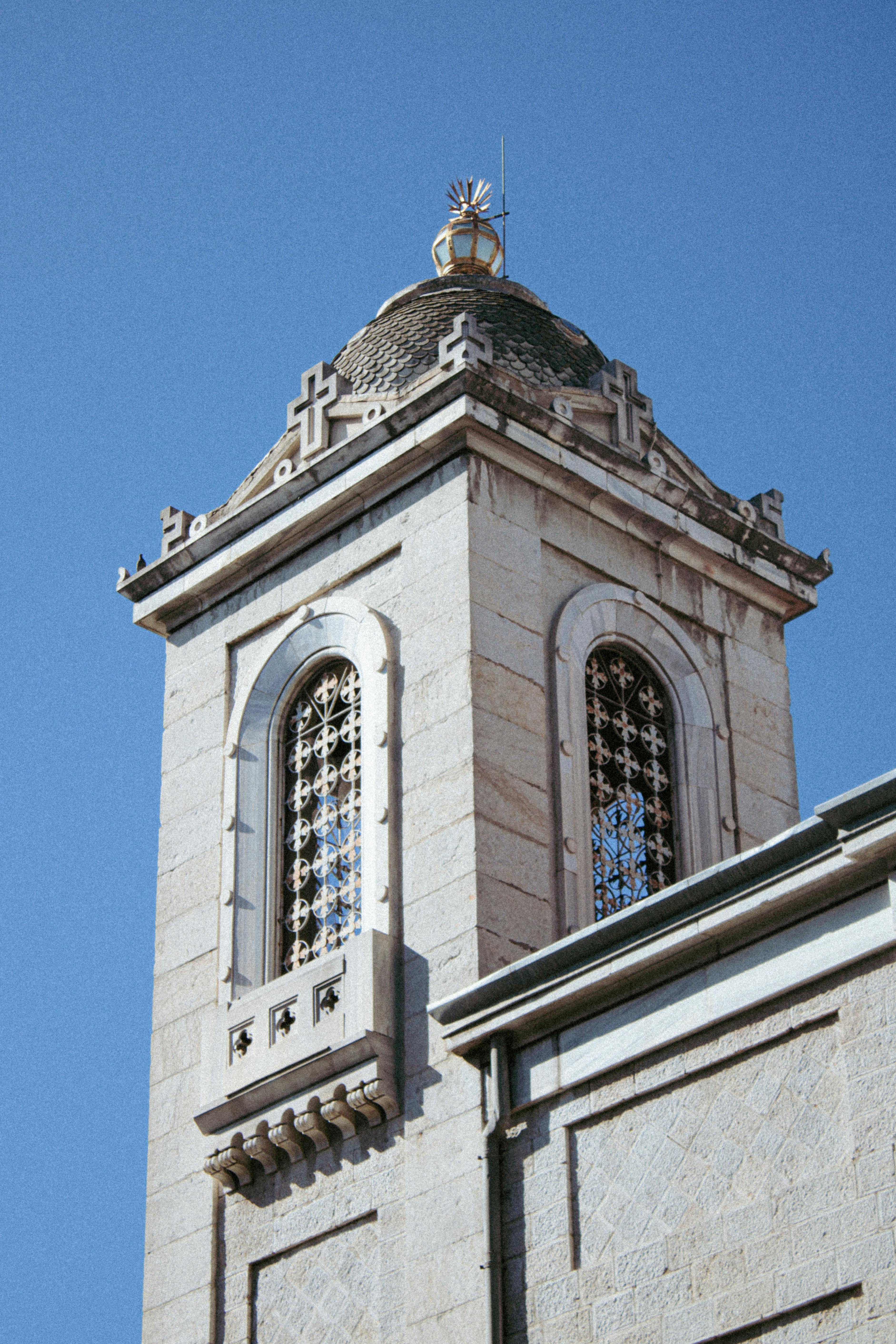 Church Belfry Facade Against the Blue Sky · Free Stock Photo