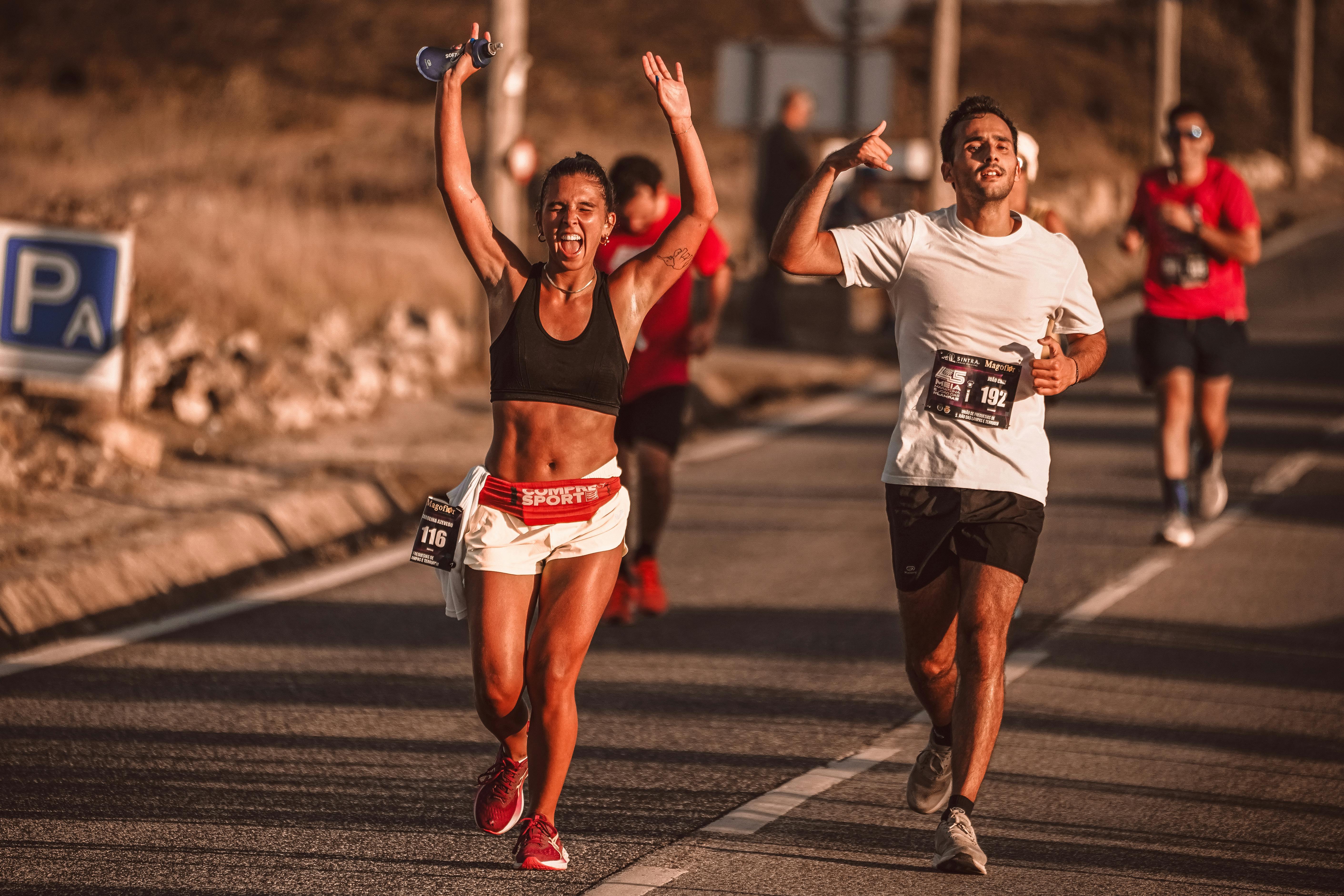People Running a Marathon and Smiling · Free Stock Photo