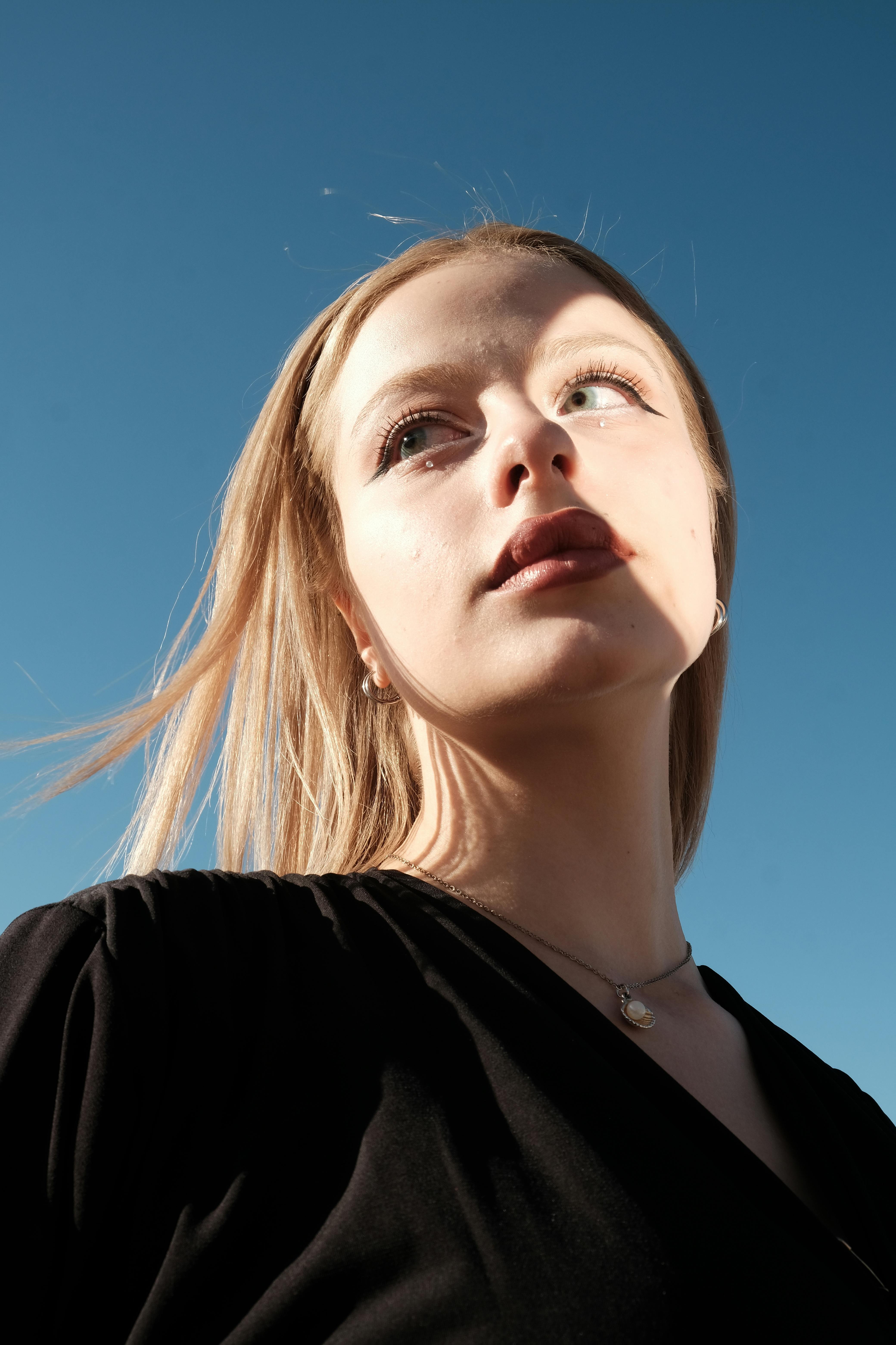 Sunlit Face of Blonde Woman · Free Stock Photo