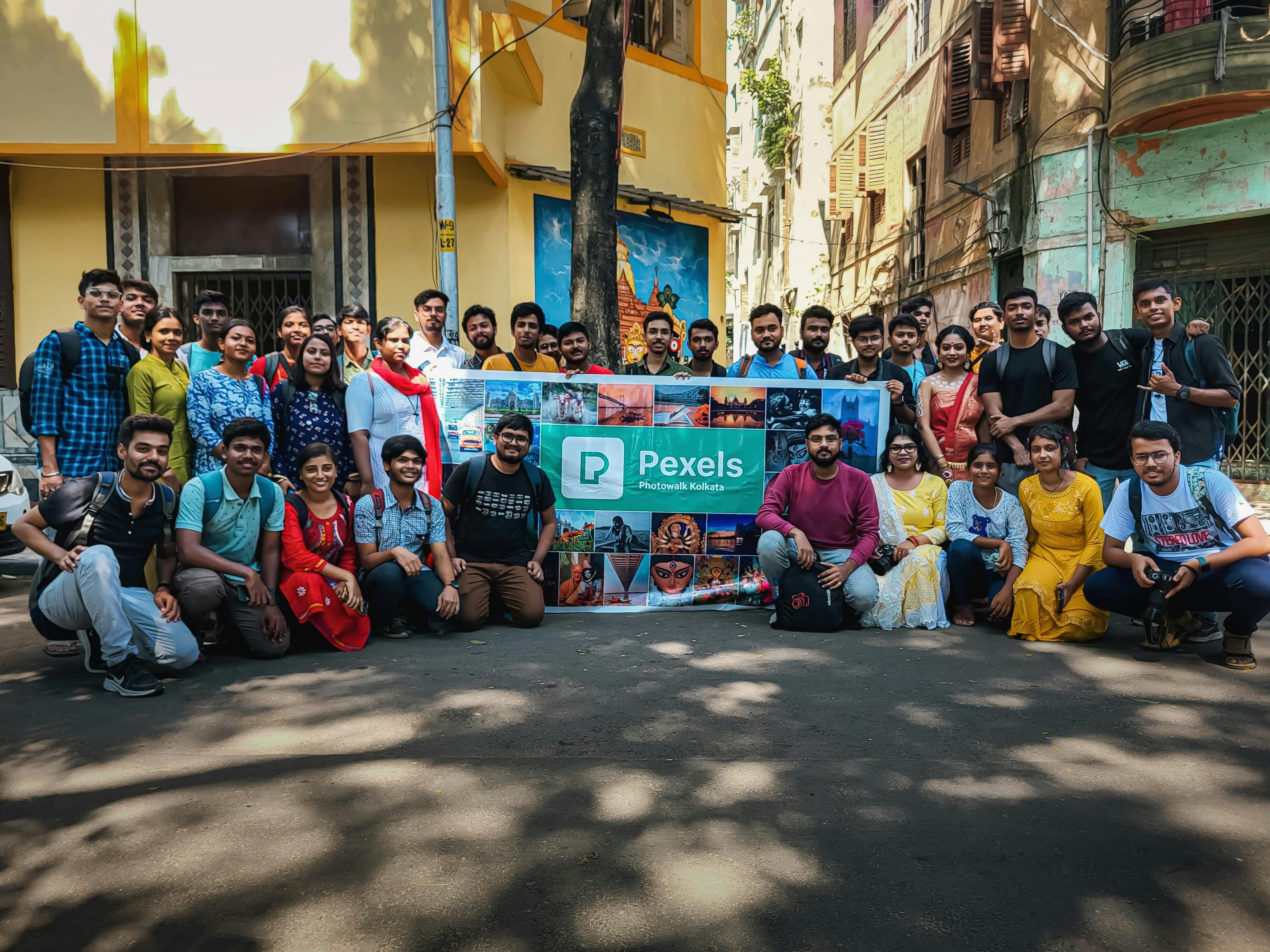 Group of Photographers with Pexels Banner in Kolkata · Free Stock Photo