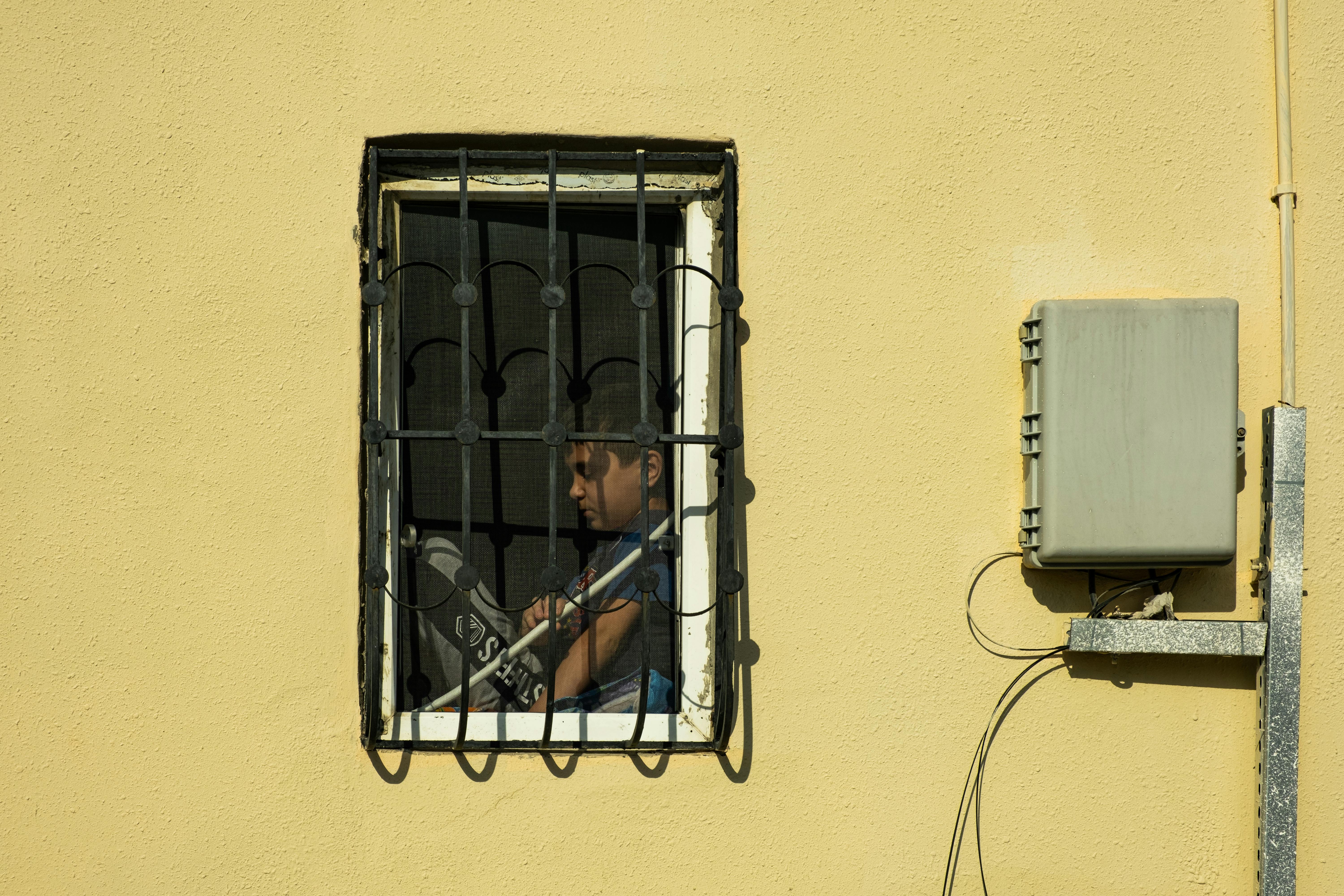 Man Seen through Window · Free Stock Photo