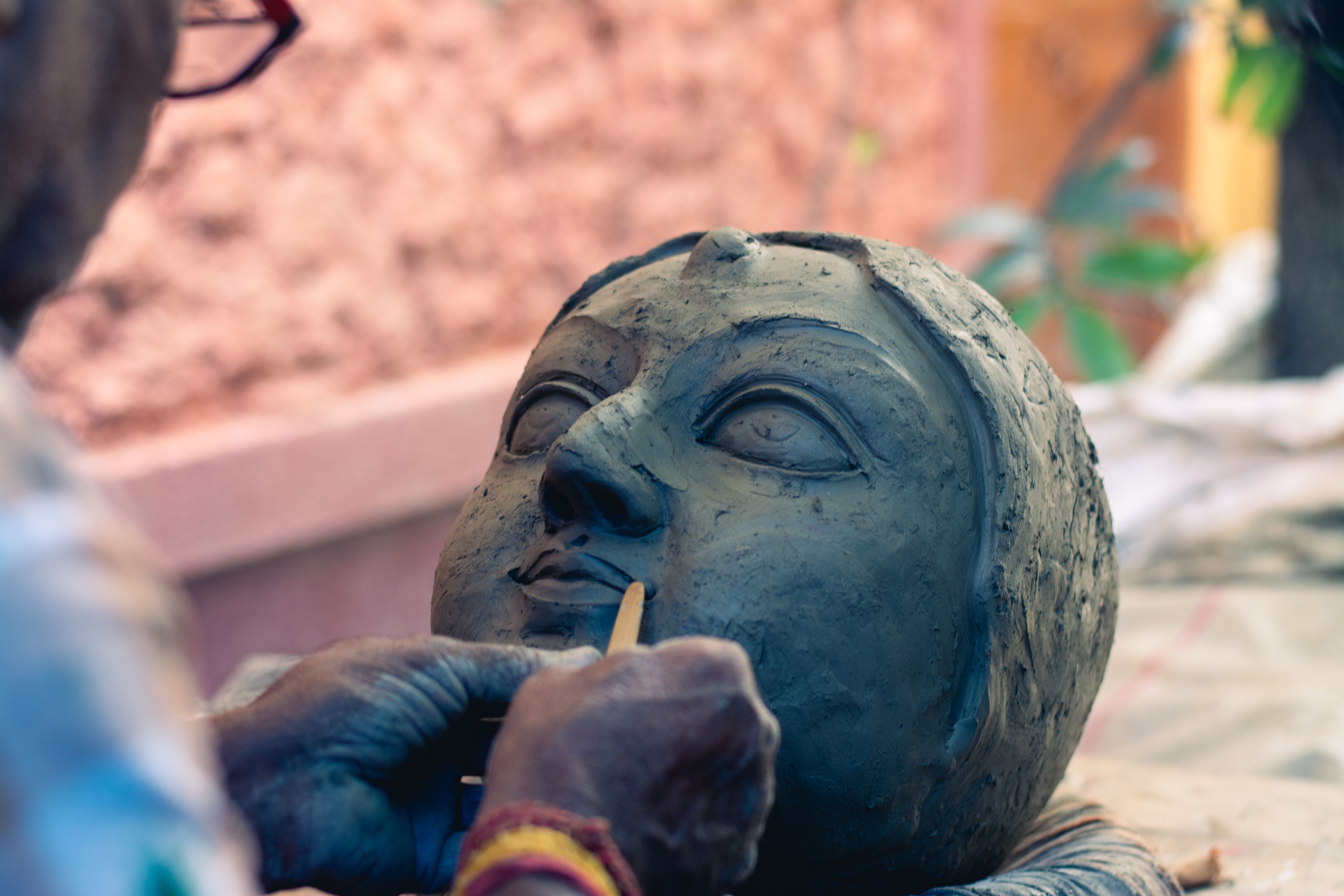 Artist Carving the Head of a Hindu Goddess · Free Stock Photo