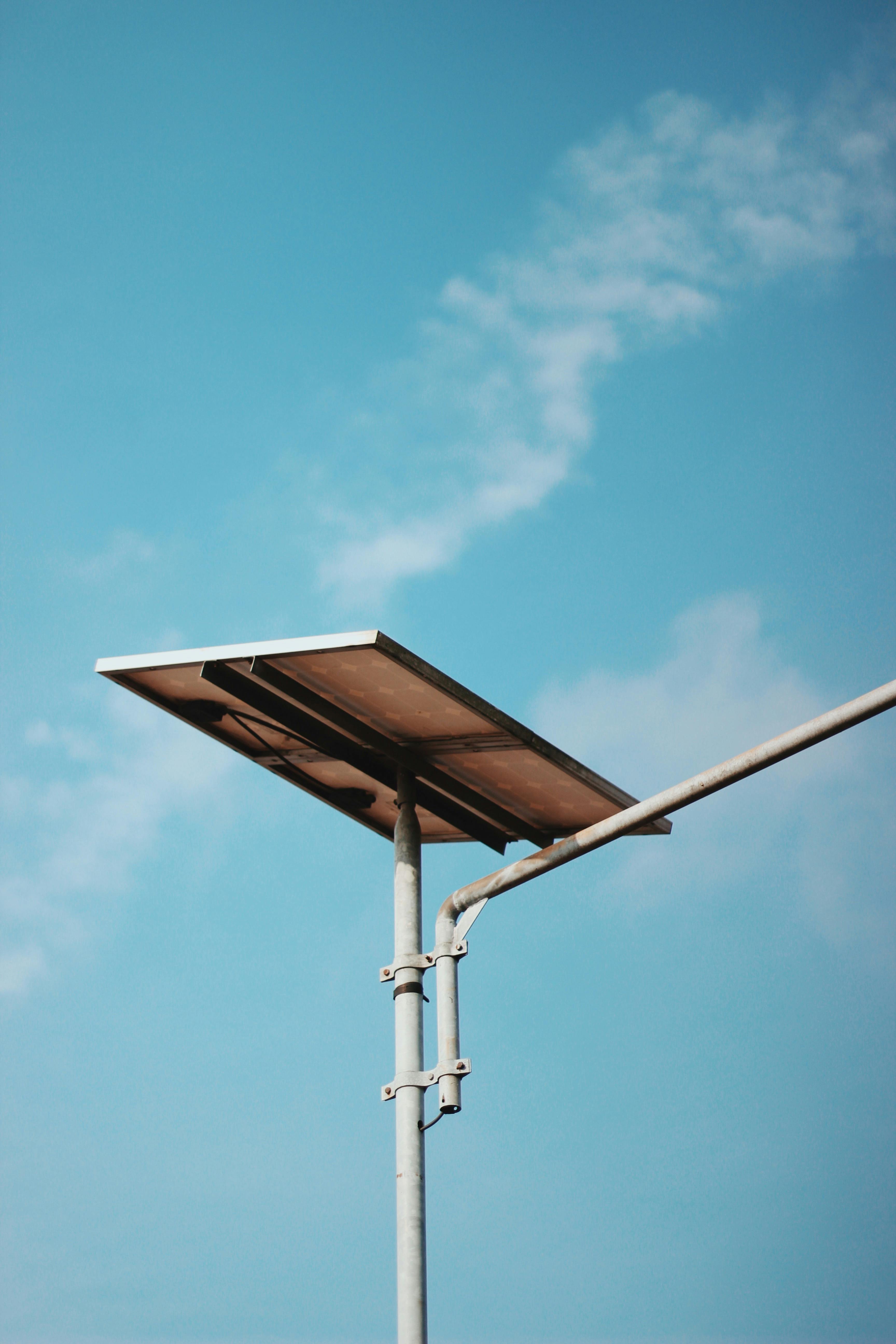 Solar Panel Powering Street Sign · Free Stock Photo
