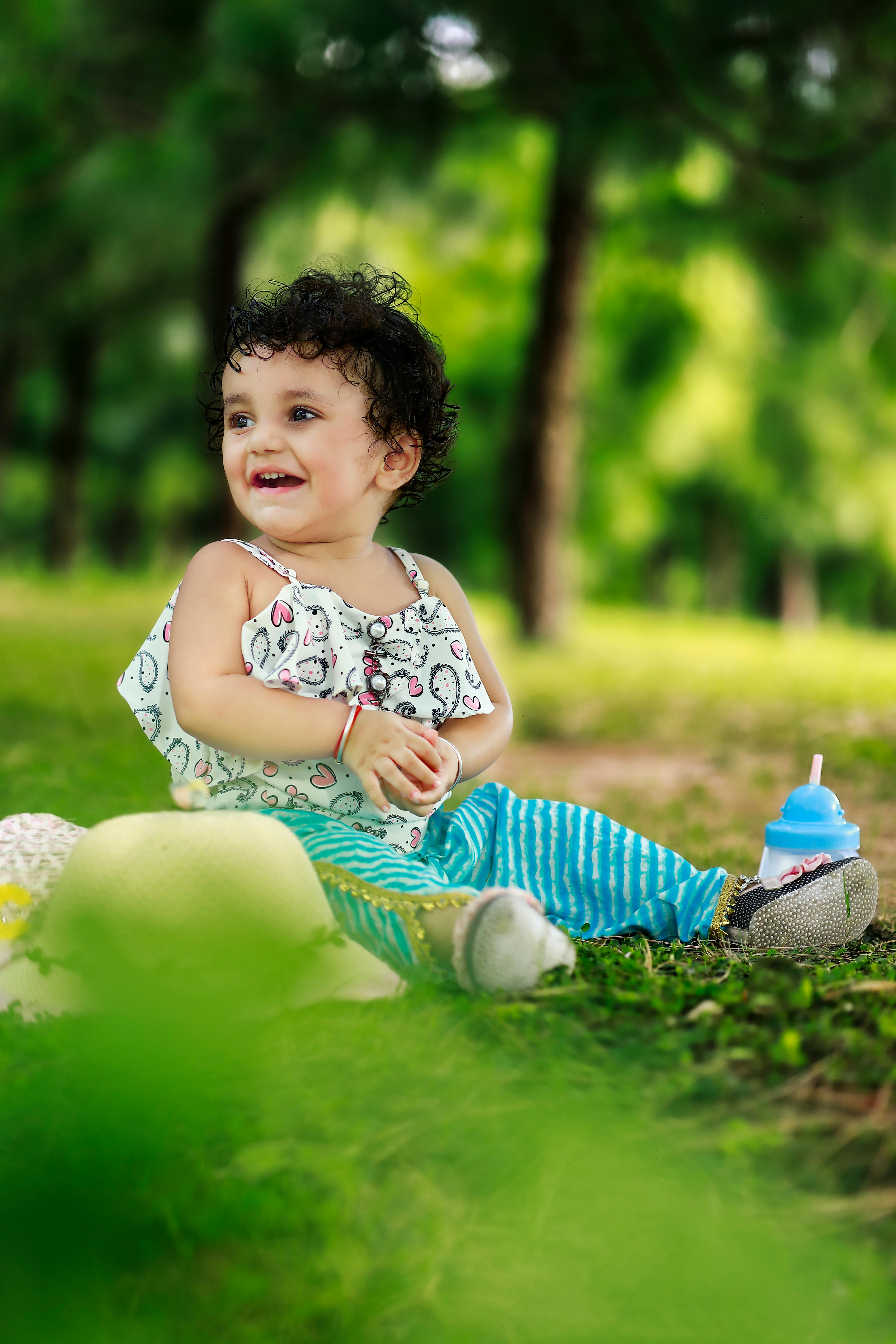 Happy Child on Toy Car · Free Stock Photo
