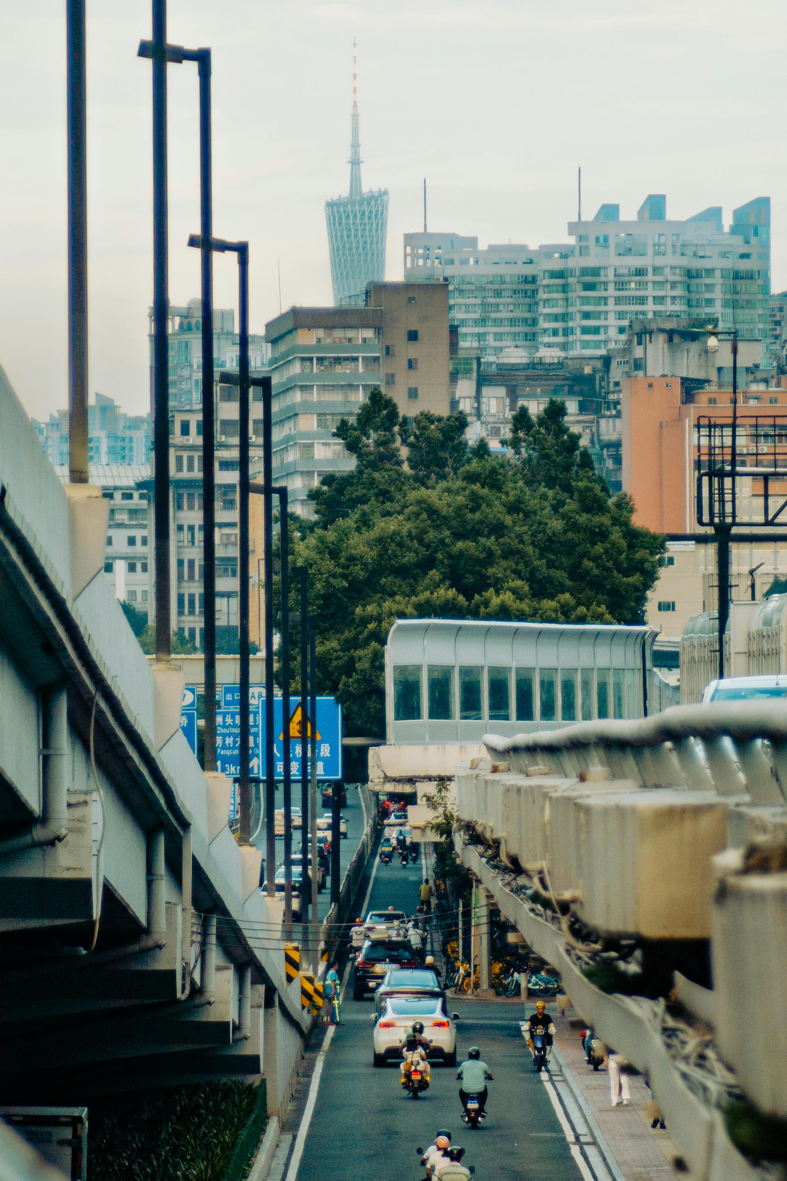 Cars and Scooters on Road by Highway in City · Free Stock Photo