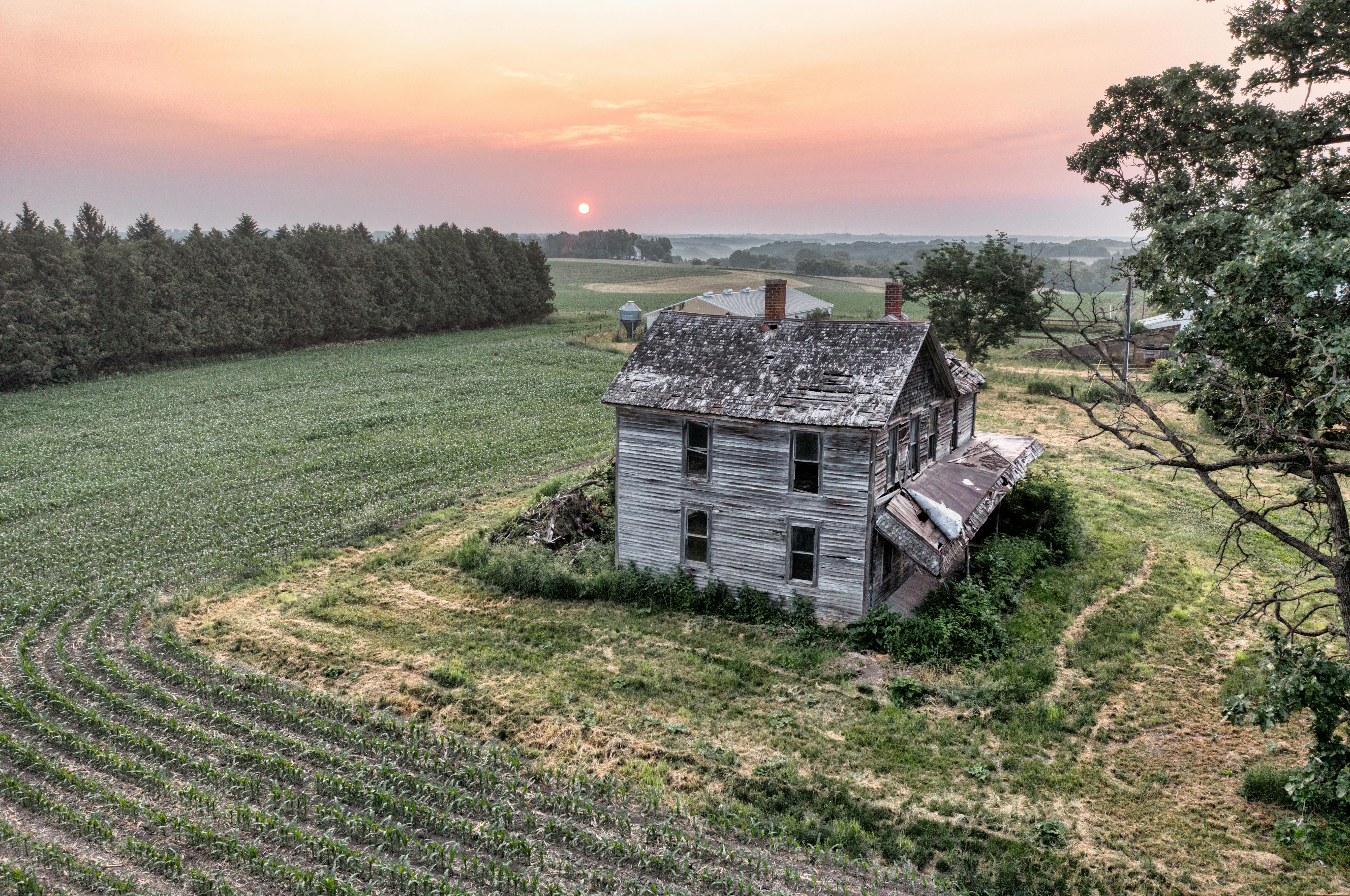 Aerial View of an Abandoned House on a Field · Free Stock Photo
