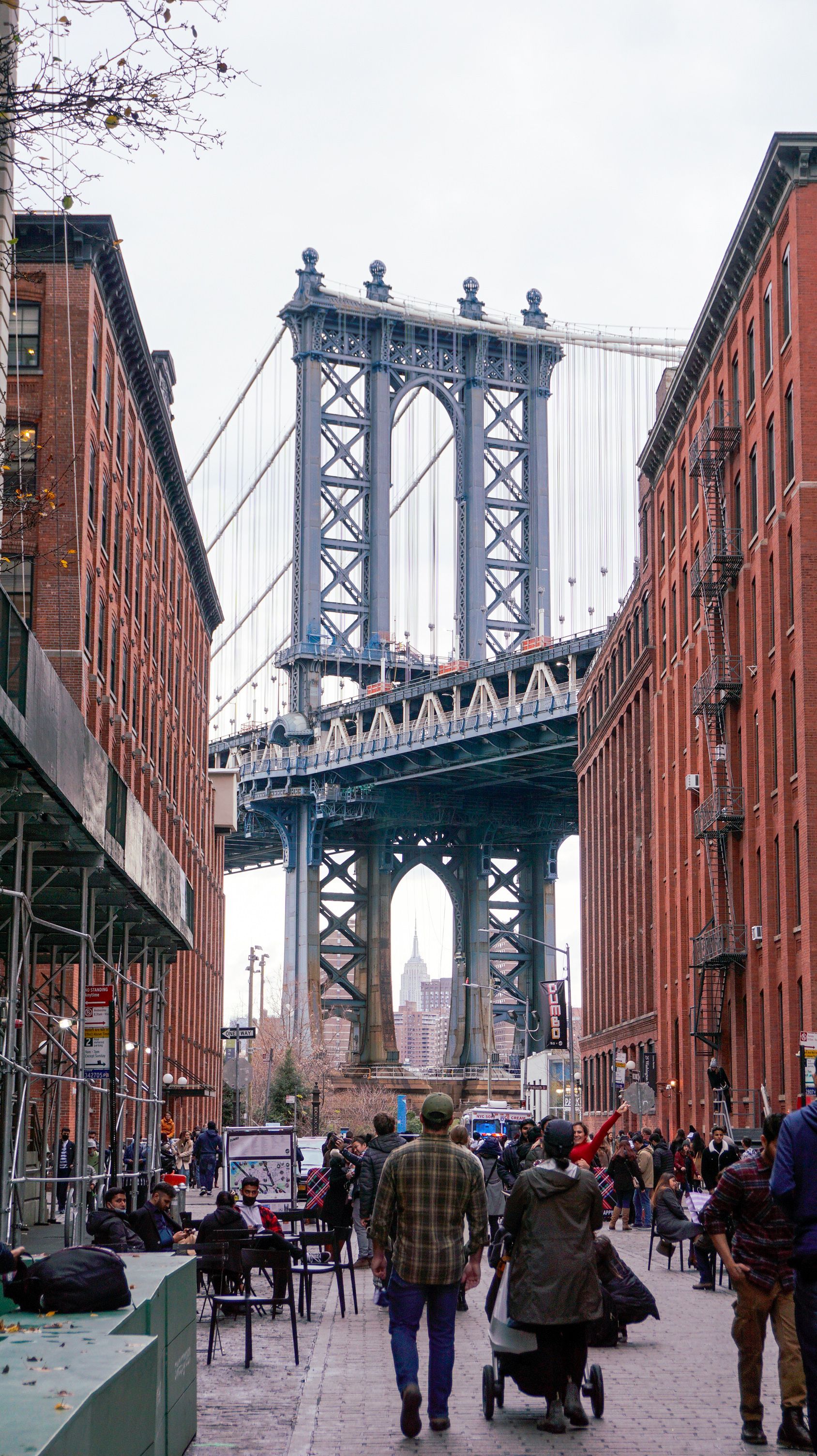 Brooklyn Bridge Seen between Buildings · Free Stock Photo