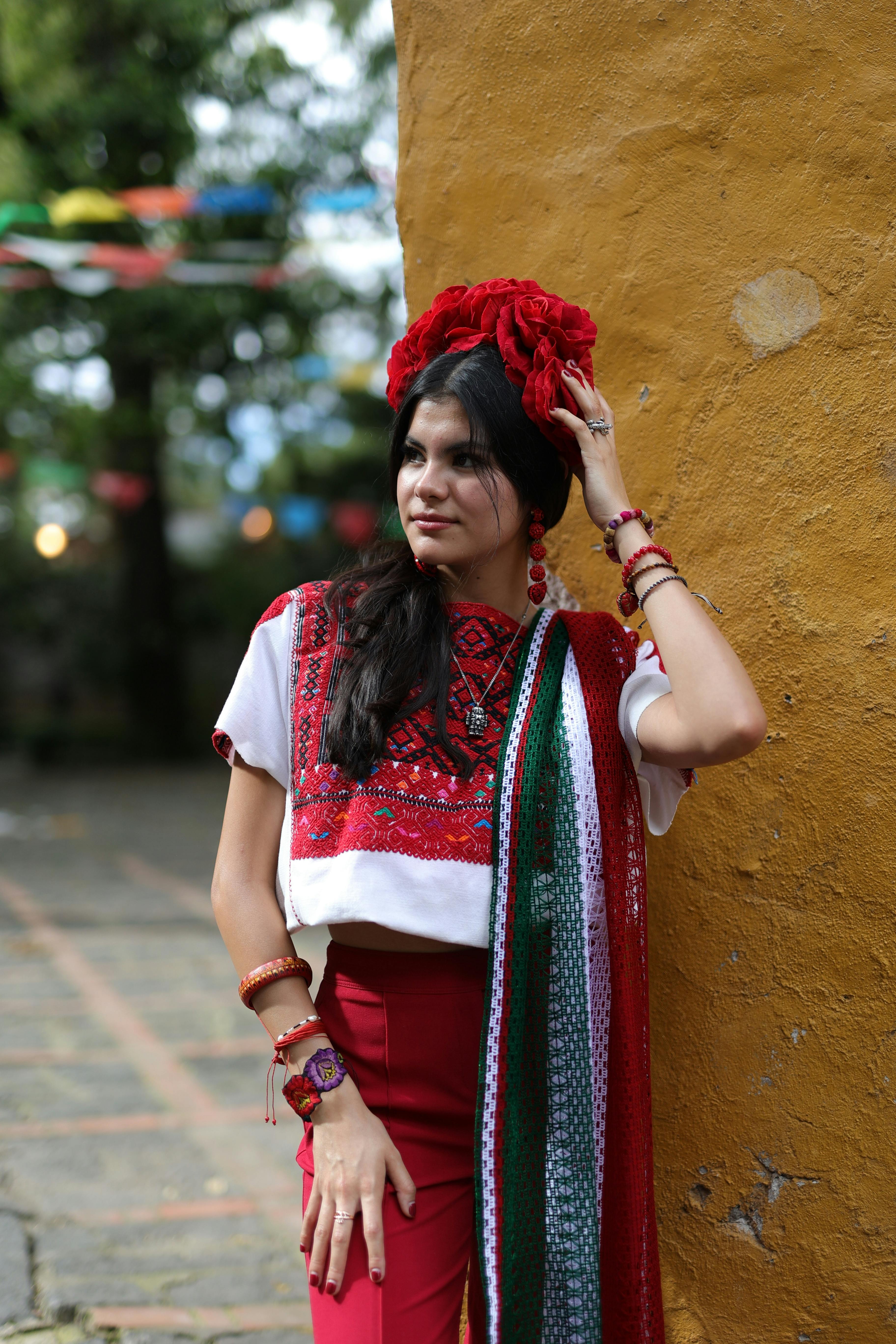A woman in a mexican outfit posing for a photo · Free Stock Photo
