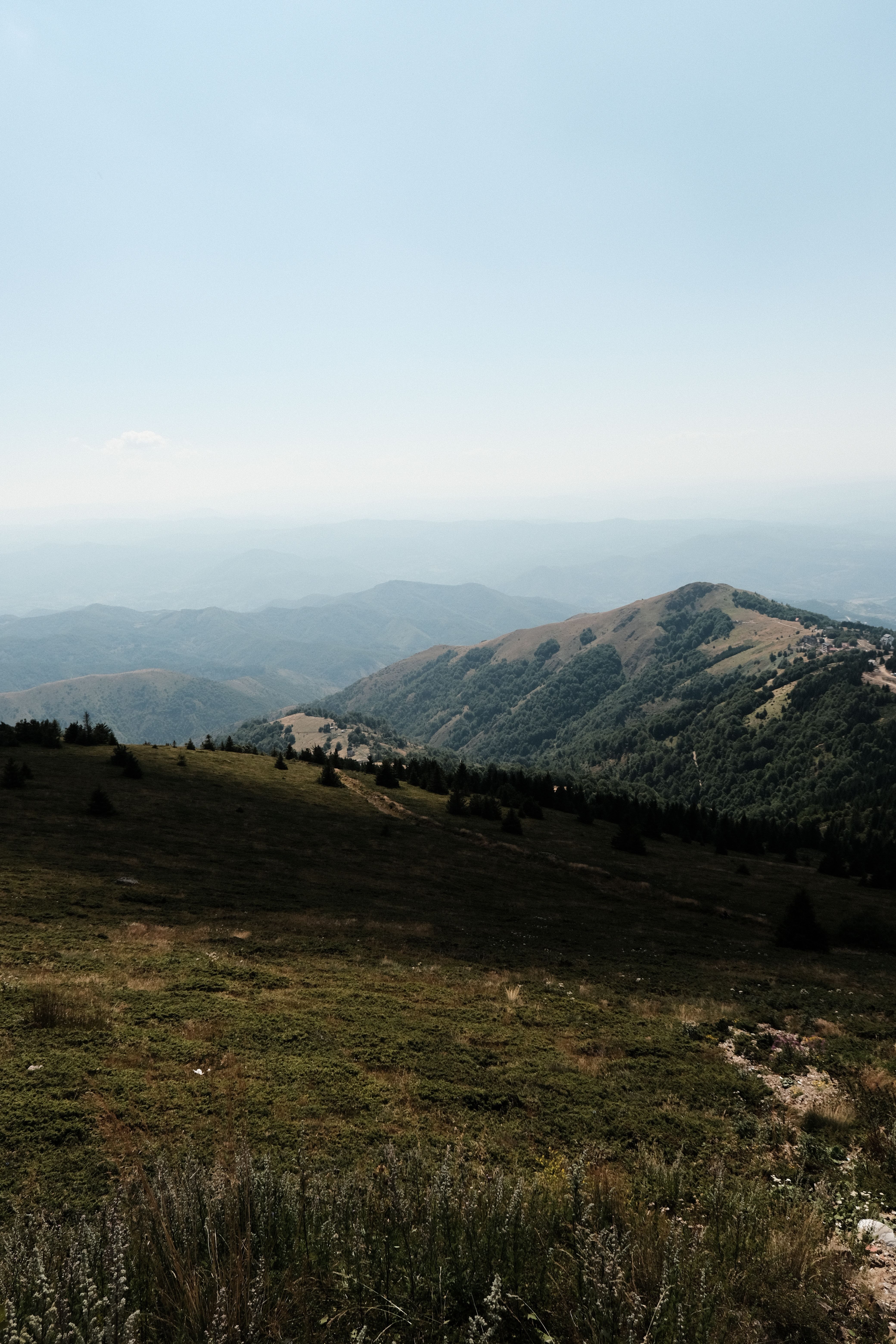 A view of the mountains from the top of a hill · Free Stock Photo