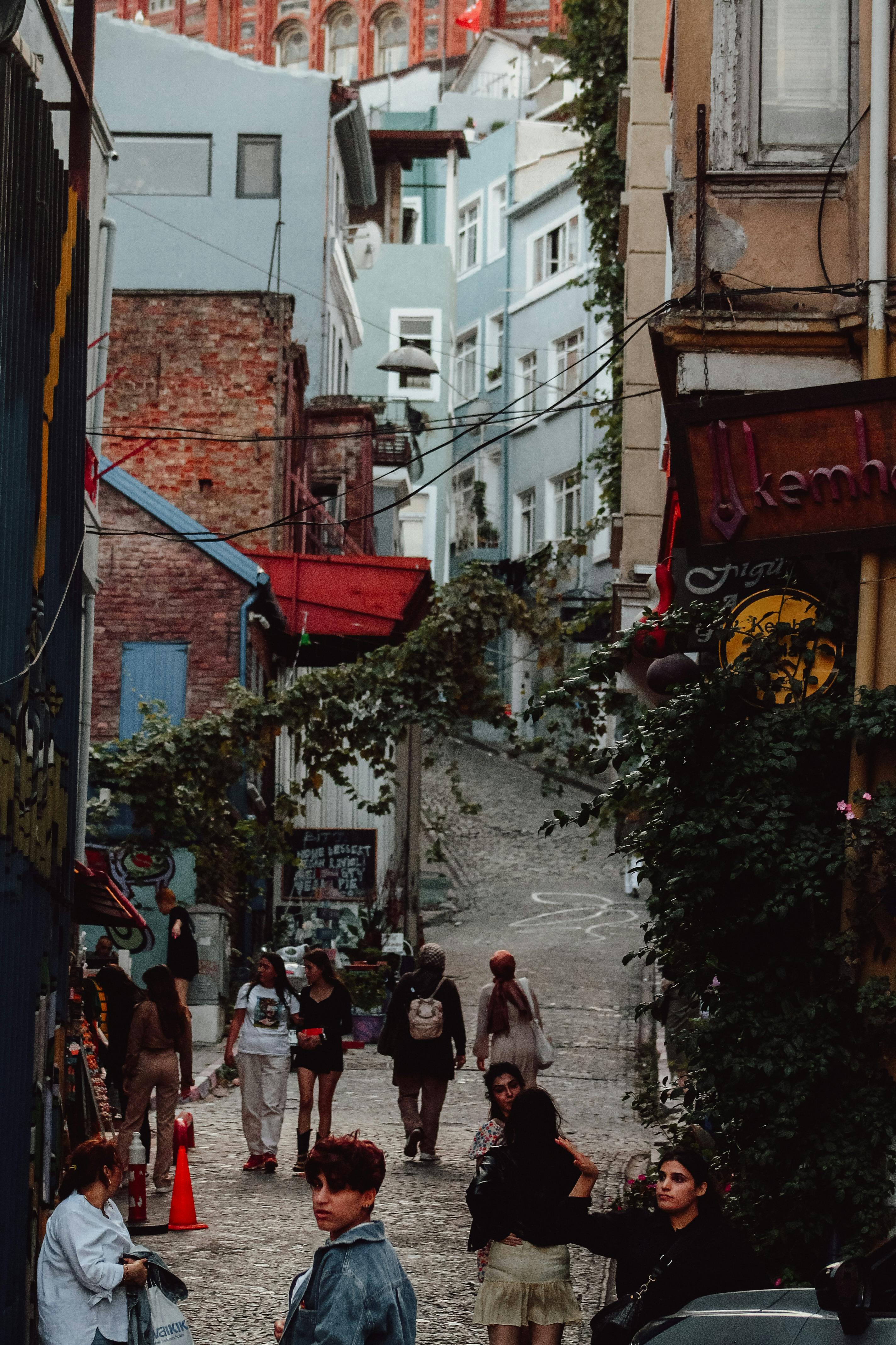 People Walking in a Cobblestone Alley between Buildings in Istanbul ...