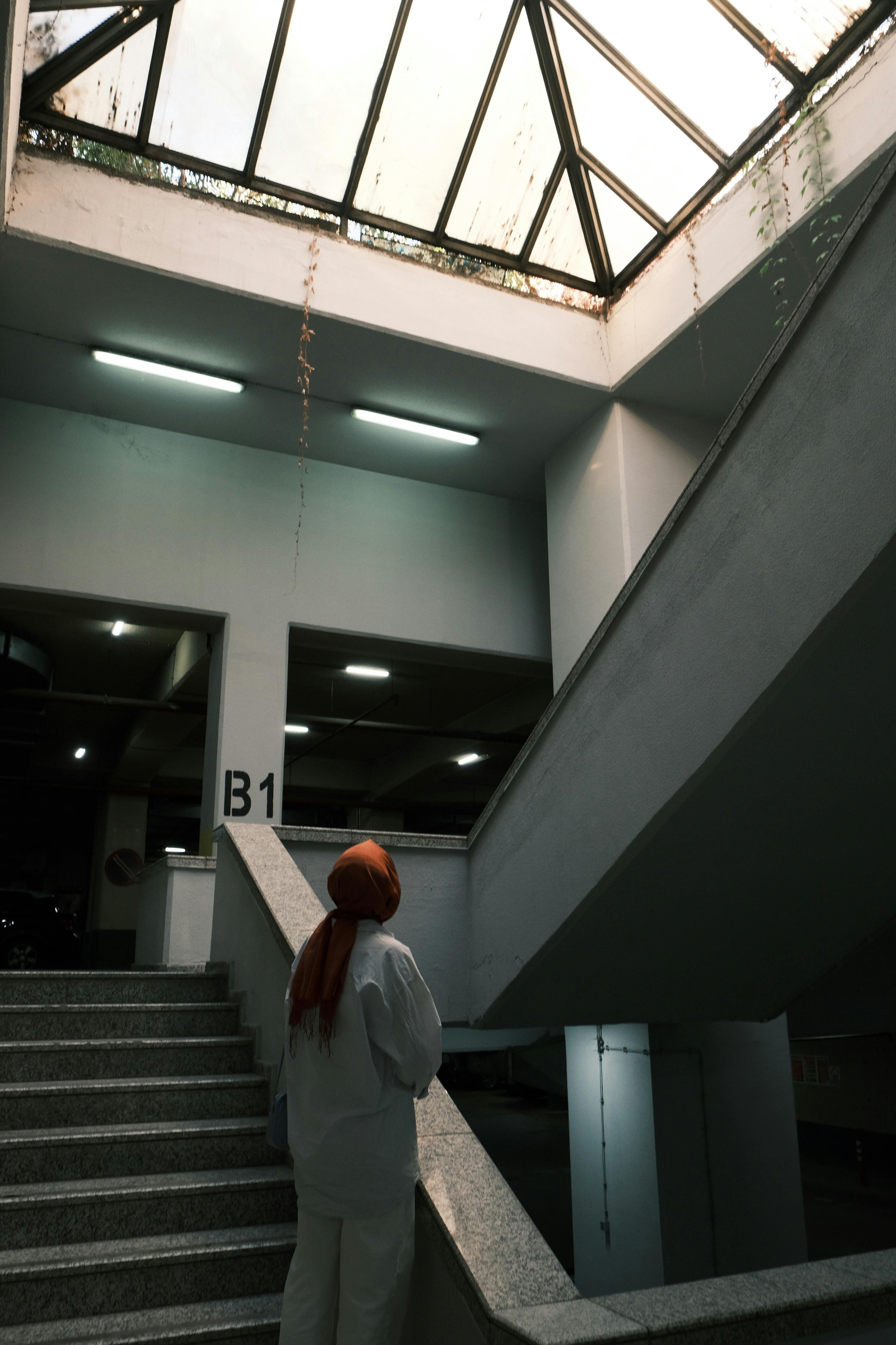 Back View of Woman Walking on the Stairs in the Central Library in ...