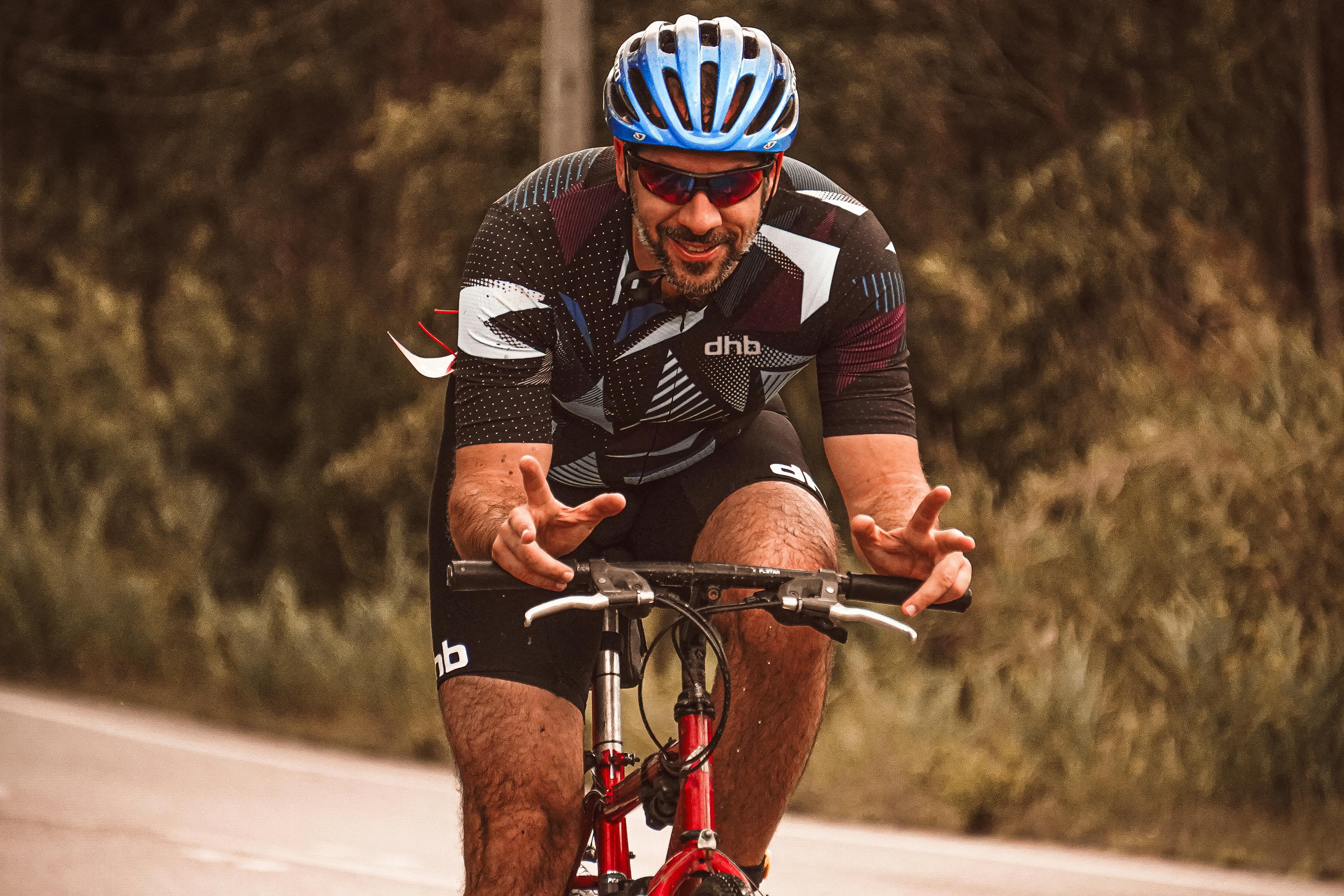 Cyclist in Blue Helmet Riding on the Street · Free Stock Photo