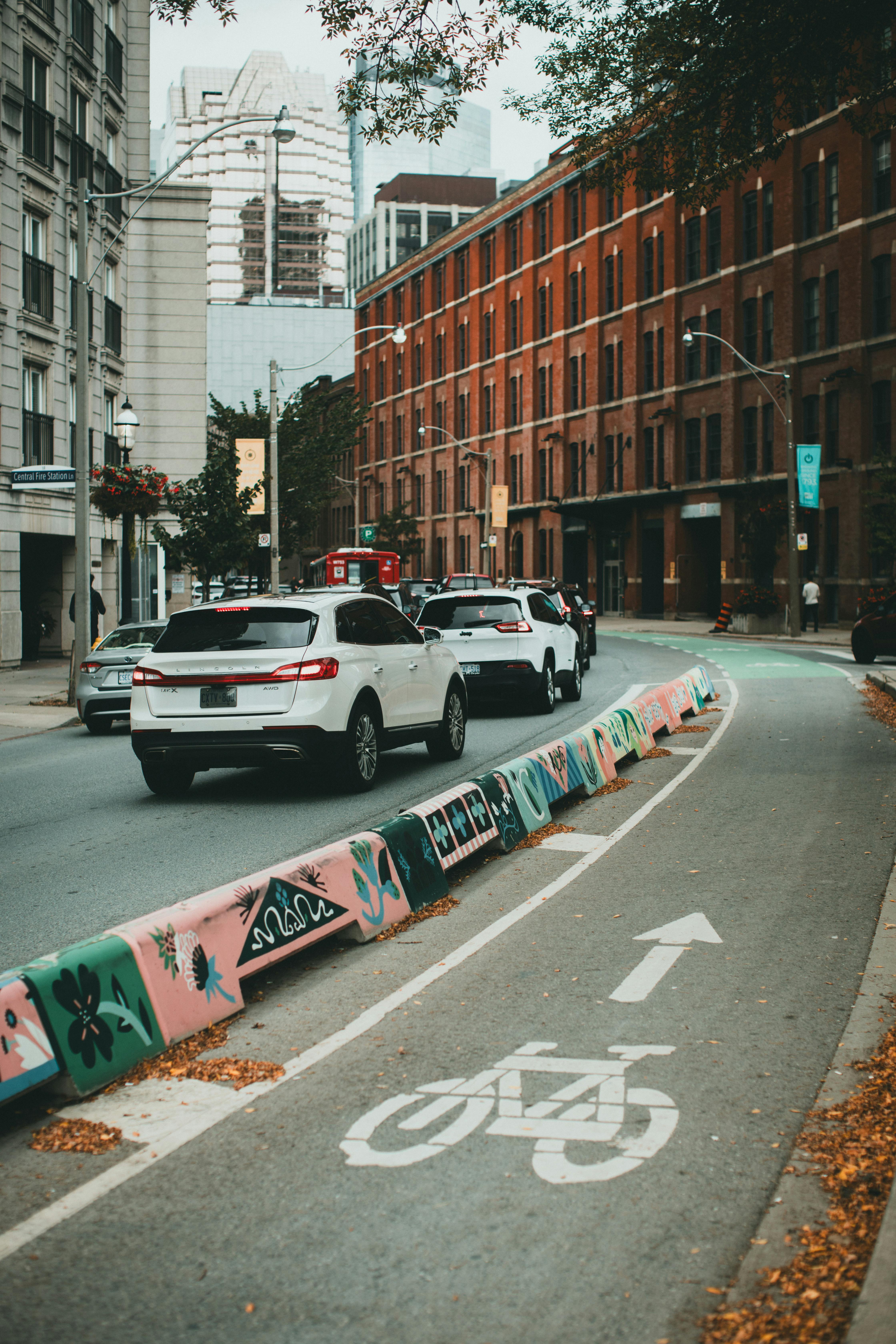 City Street with Empty Bicycle Lane and Cars on a Busy Road · Free ...