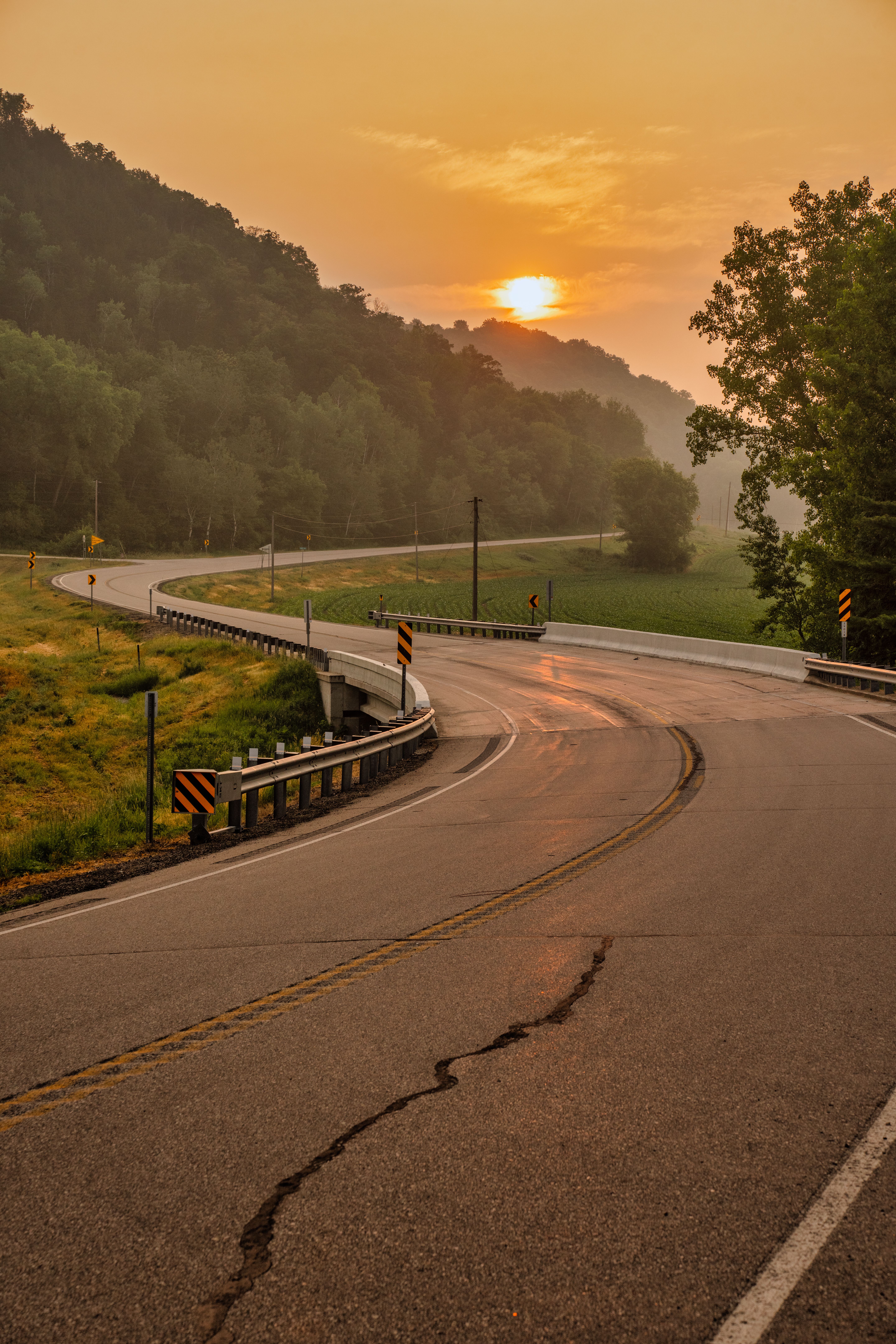 Road Turns in a Scenic Landscape at Sunrise · Free Stock Photo