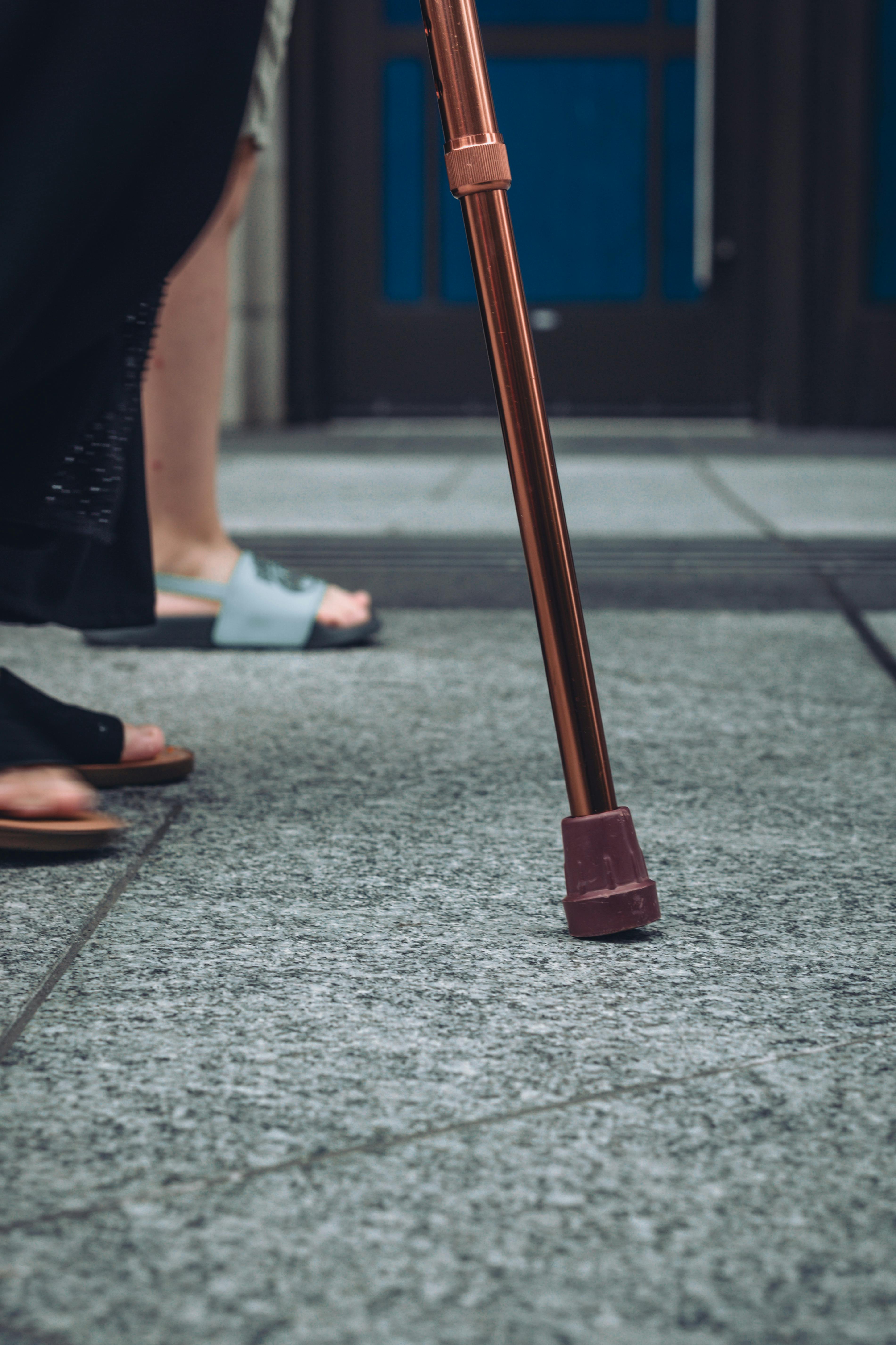 Walking Stick of Standing Woman · Free Stock Photo