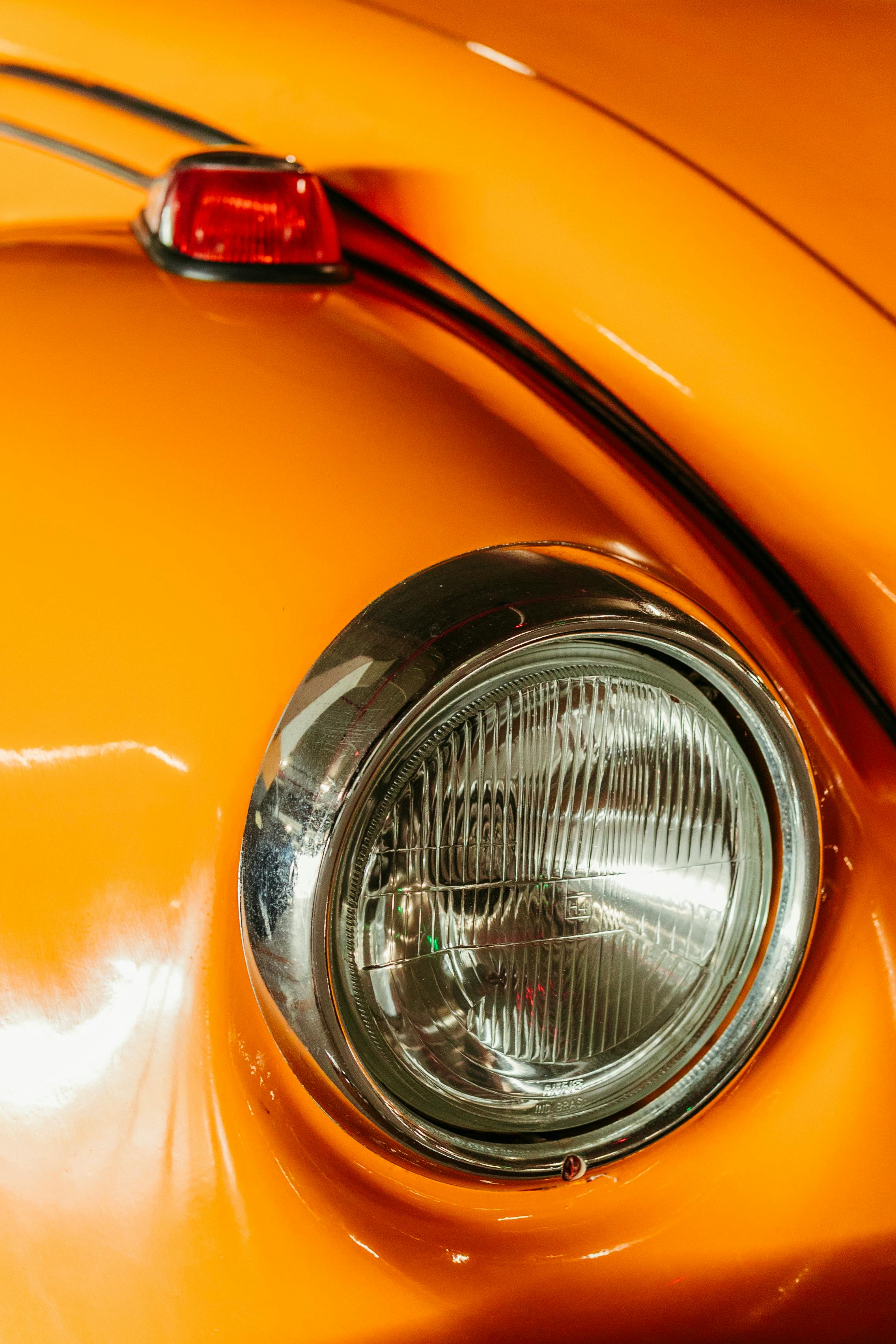 Close-Up Photo of an Orange Volkswagen Beetle Car Headlight · Free ...