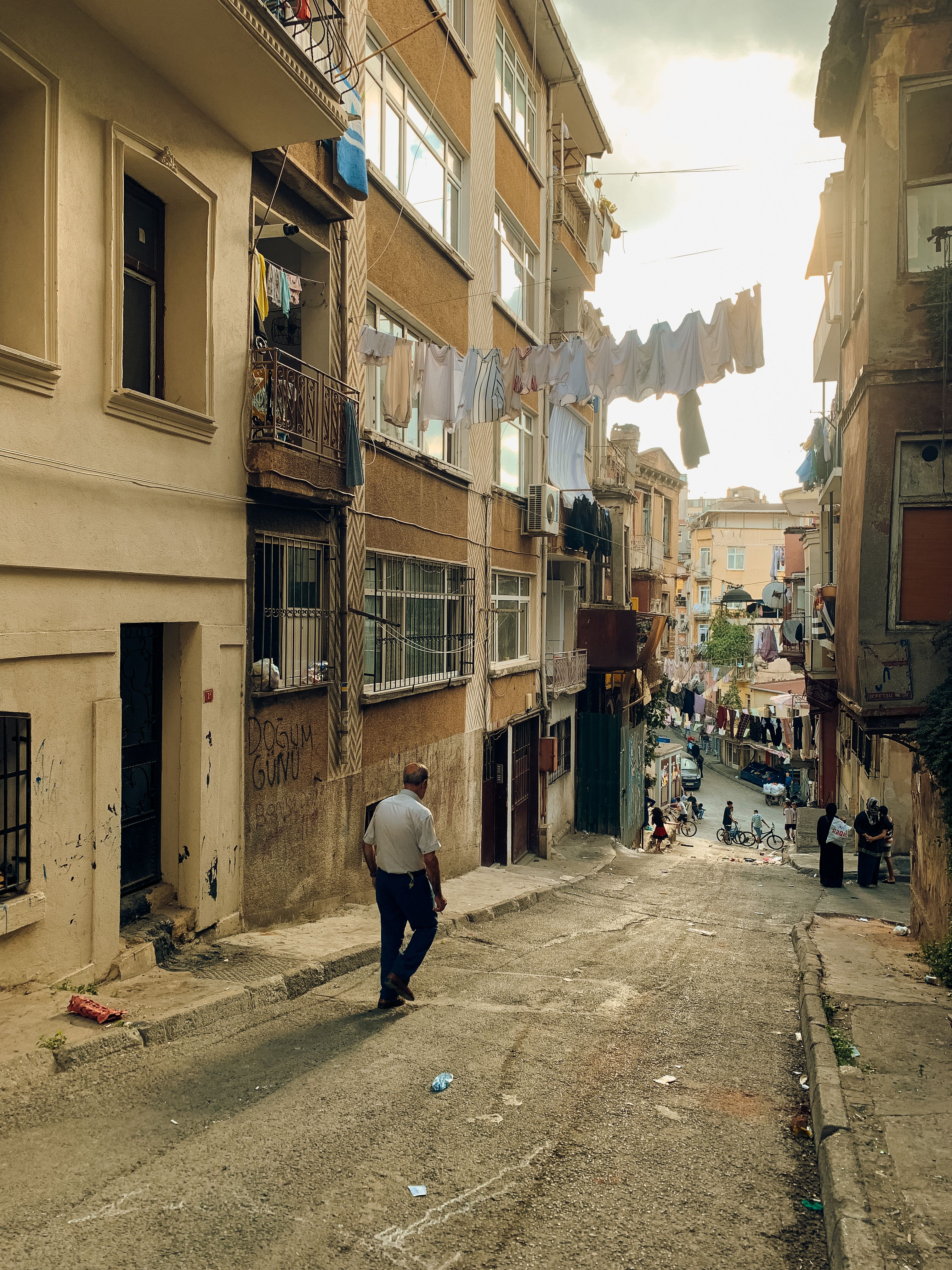 City Street with a Laundry Line Between Buildings · Free Stock Photo