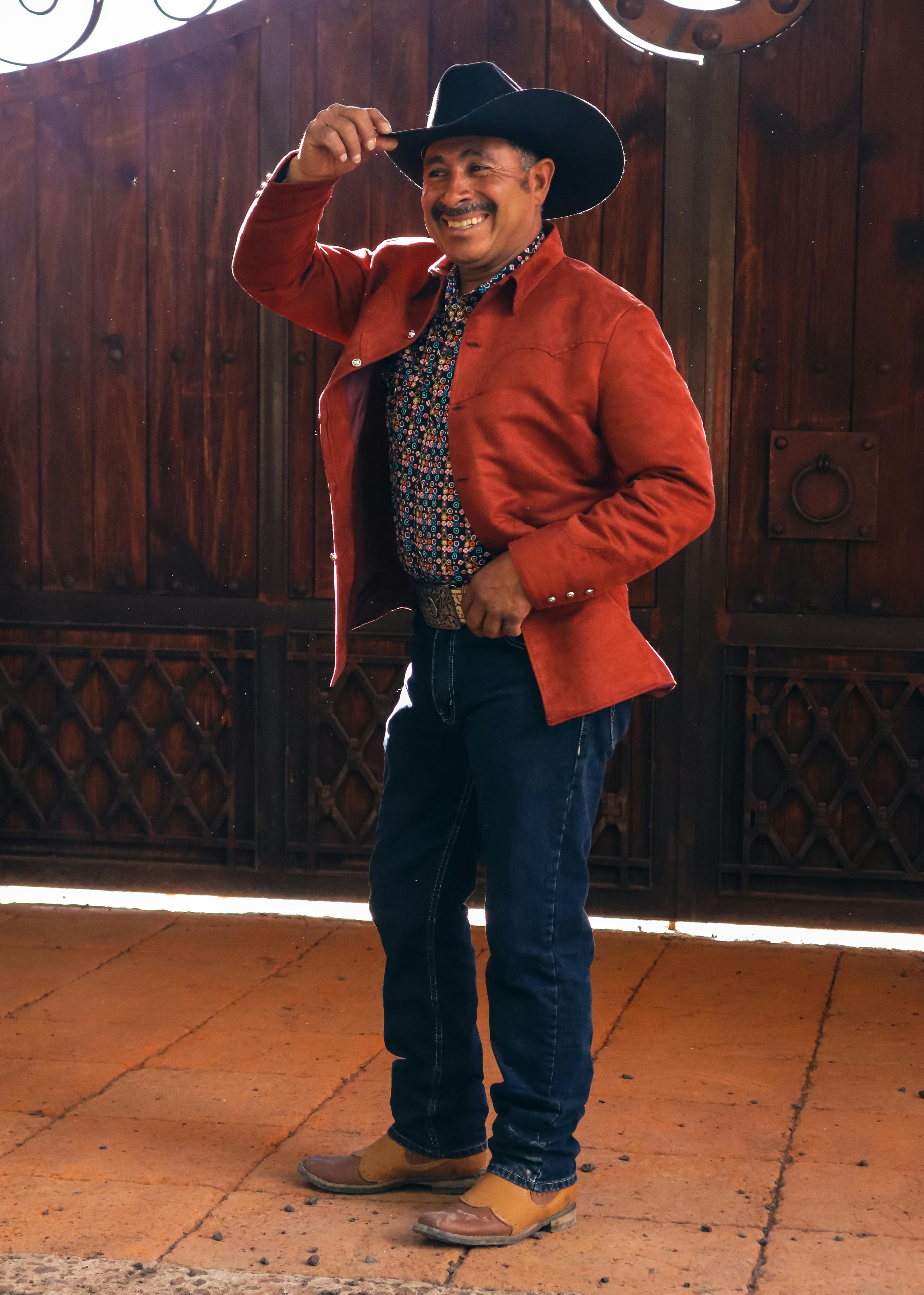 Man with Mustache Wearing a Cowboy Hat and Smiling · Free Stock Photo