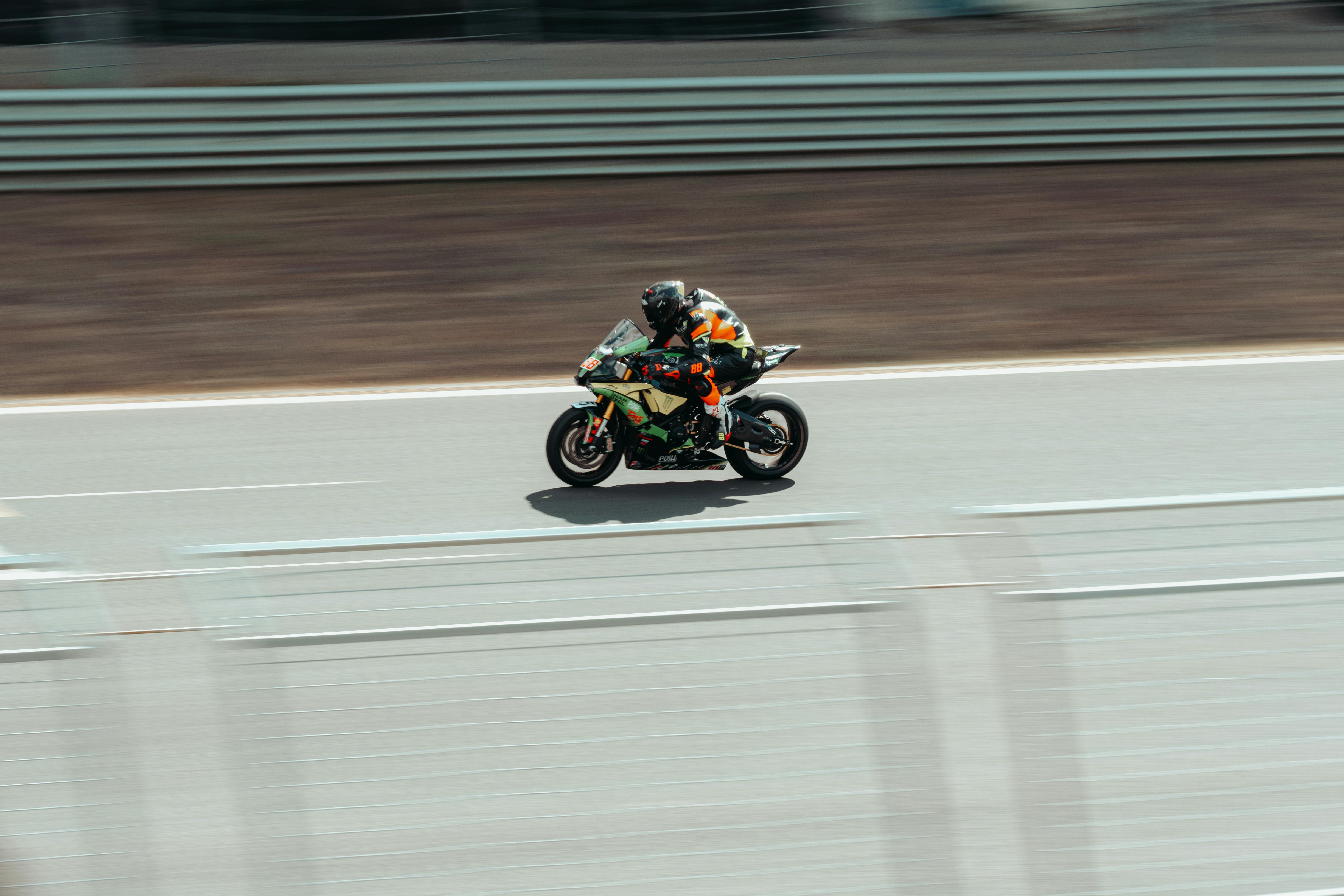 Man Riding Motorcycle on a Racing Track · Free Stock Photo