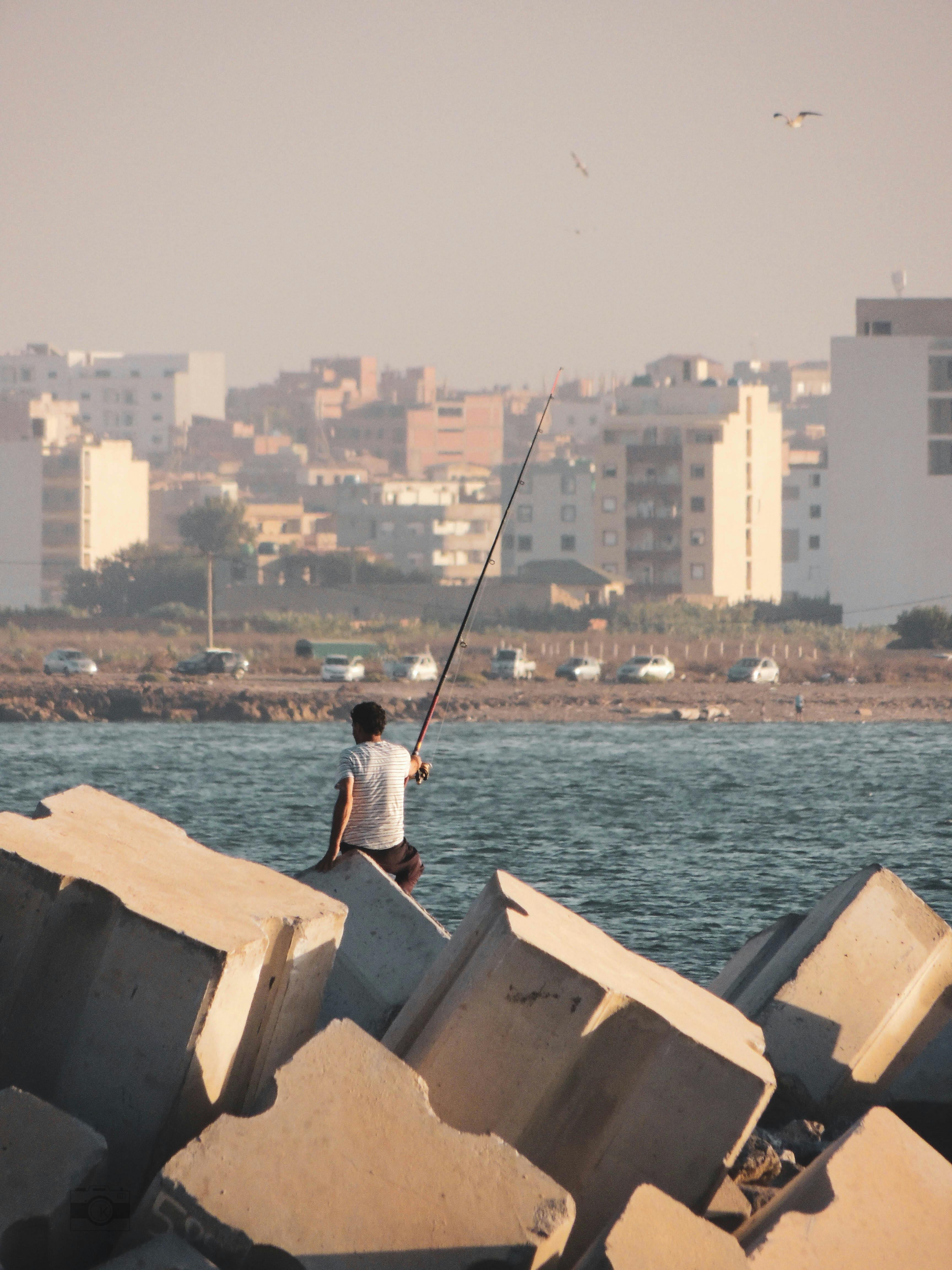 A Man with a Fishing Rod · Free Stock Photo