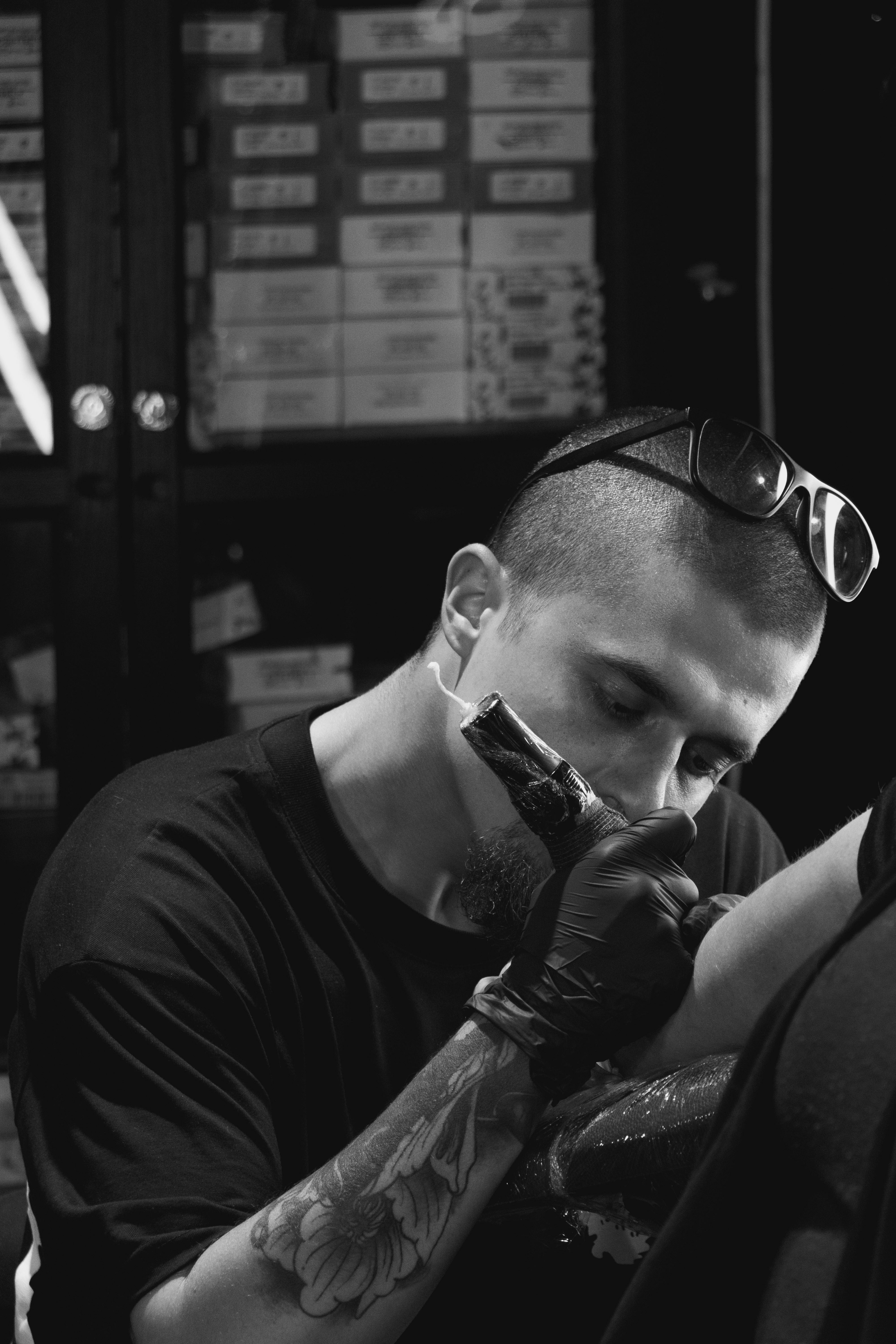 Man Tattooing Tattoos on Arm · Free Stock Photo