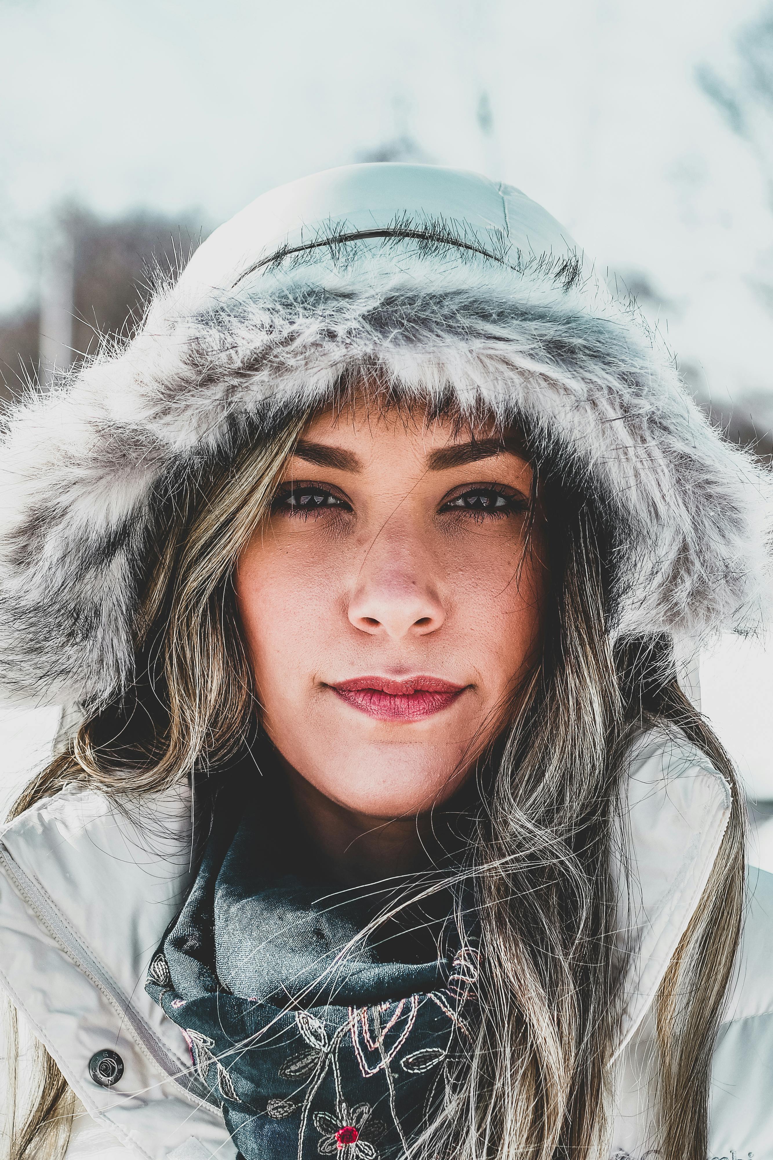 Portrait of a Cute Woman in a Hood · Free Stock Photo
