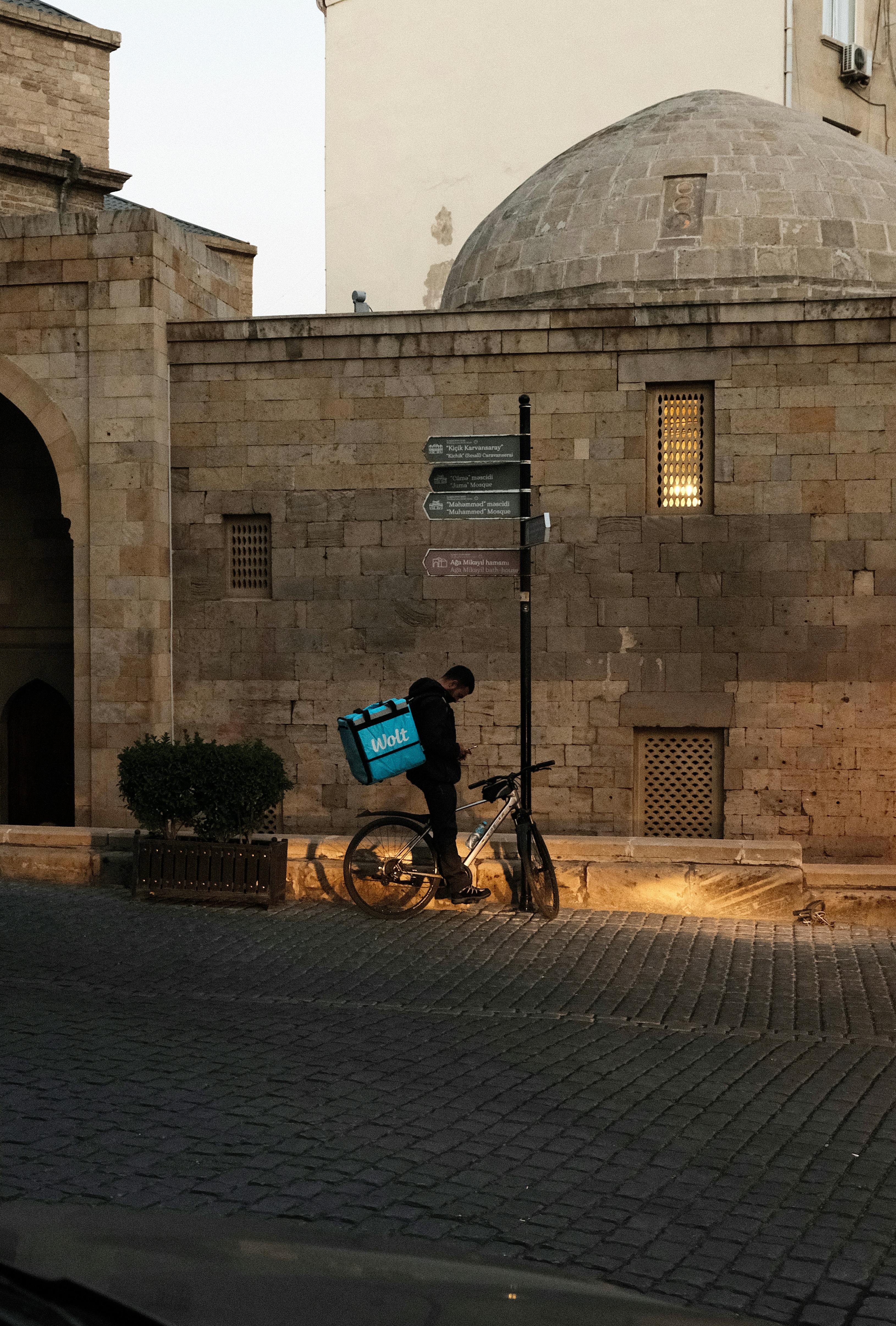 Wolt Delivery Driver in Old Town in Baku · Free Stock Photo