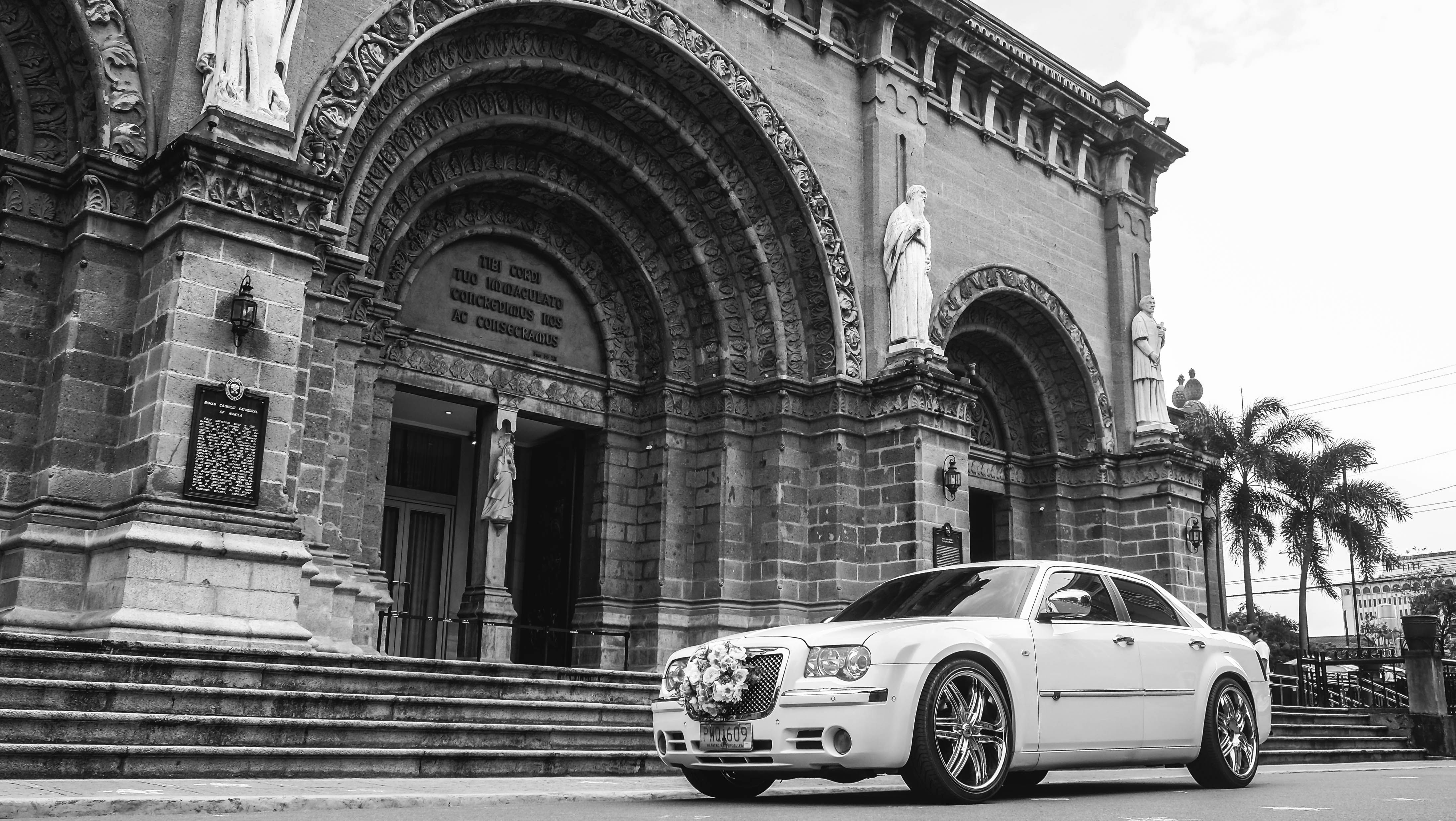 Luxury Car in Front of a Church in Black and White · Free Stock Photo