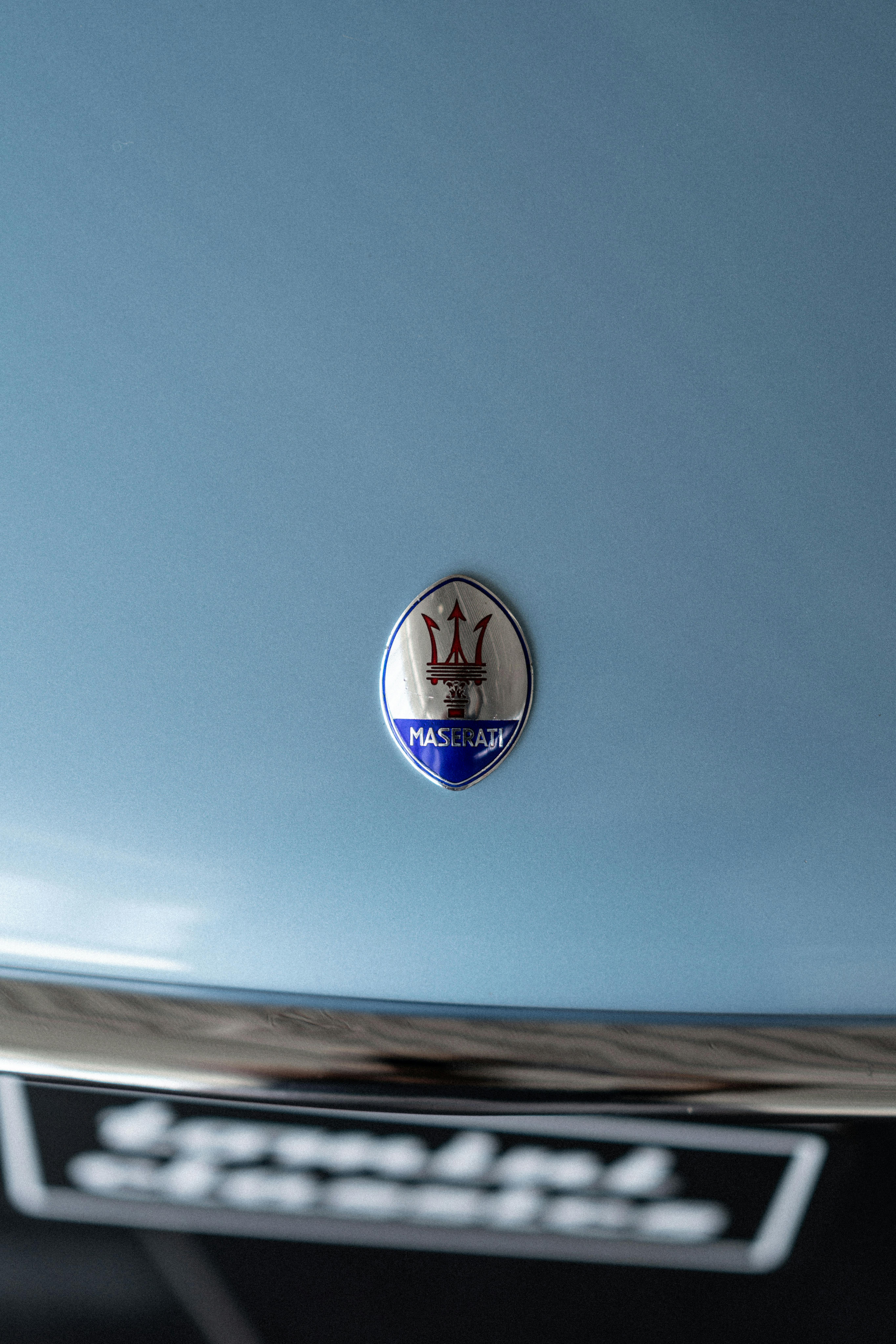 Close-up of the Emblem on the Hood of a Maserati · Free Stock Photo
