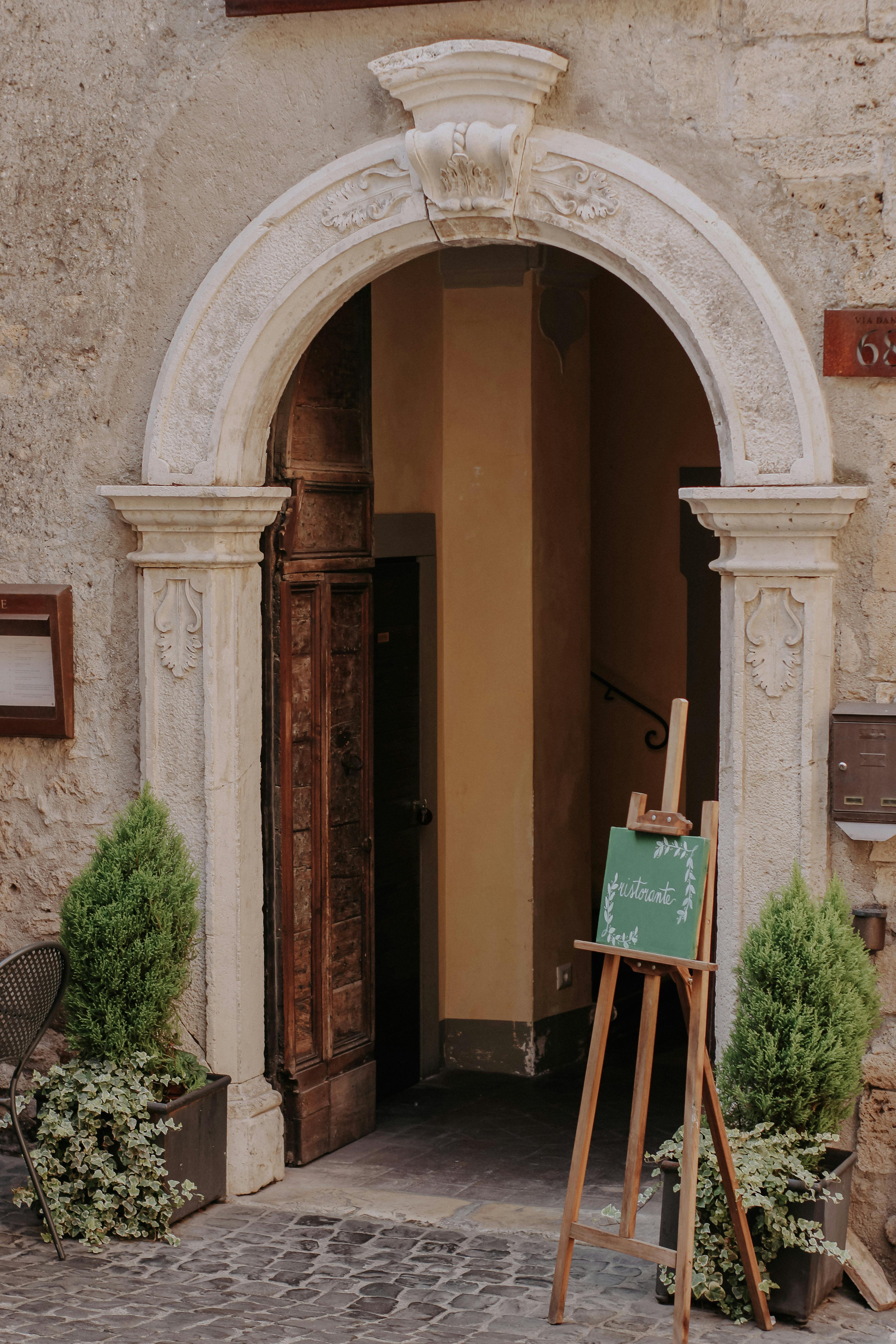 Sign on Easel by Entrance Gate · Free Stock Photo