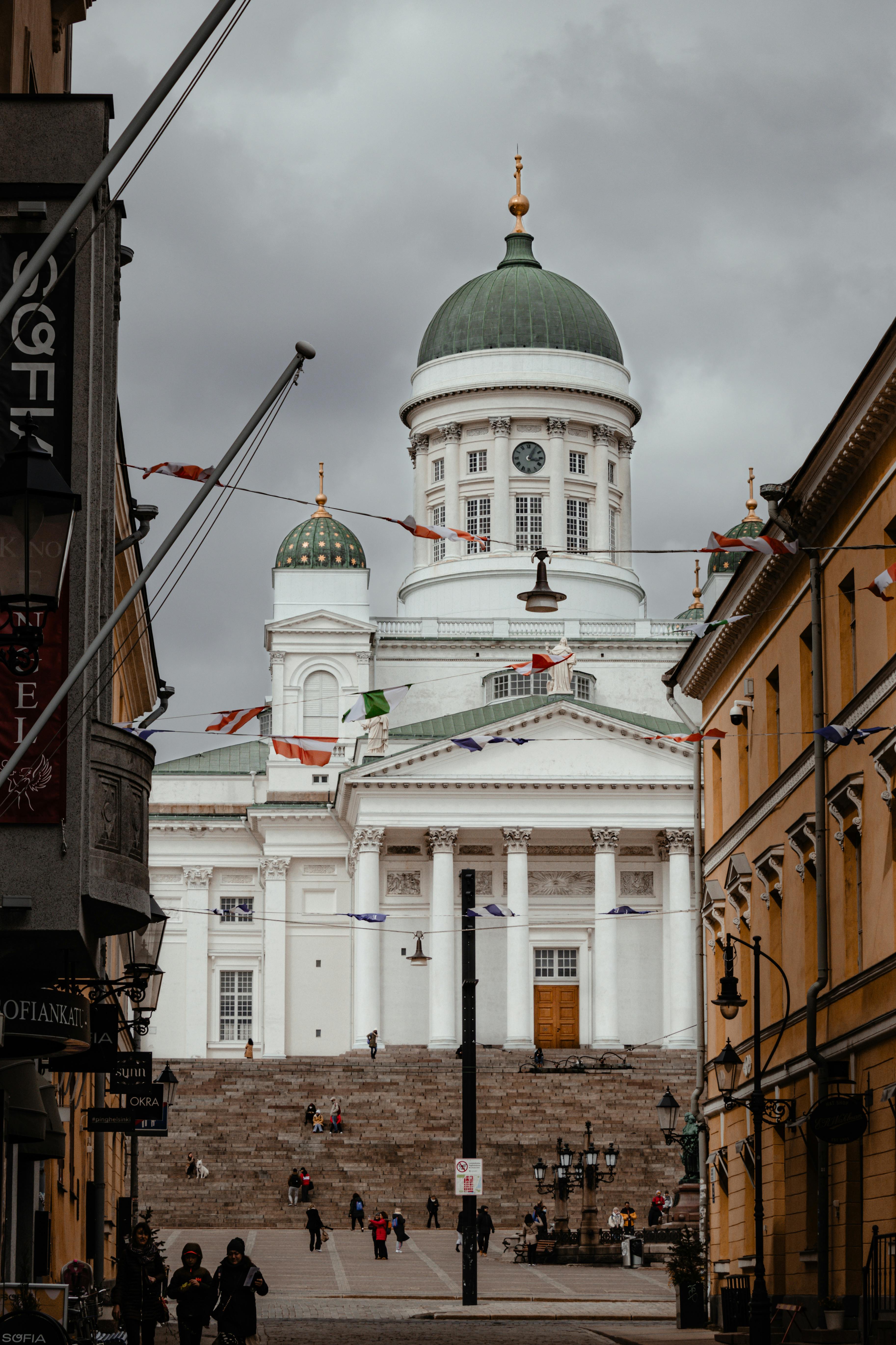 Photo of Cathedral Near Buildings and River · Free Stock Photo