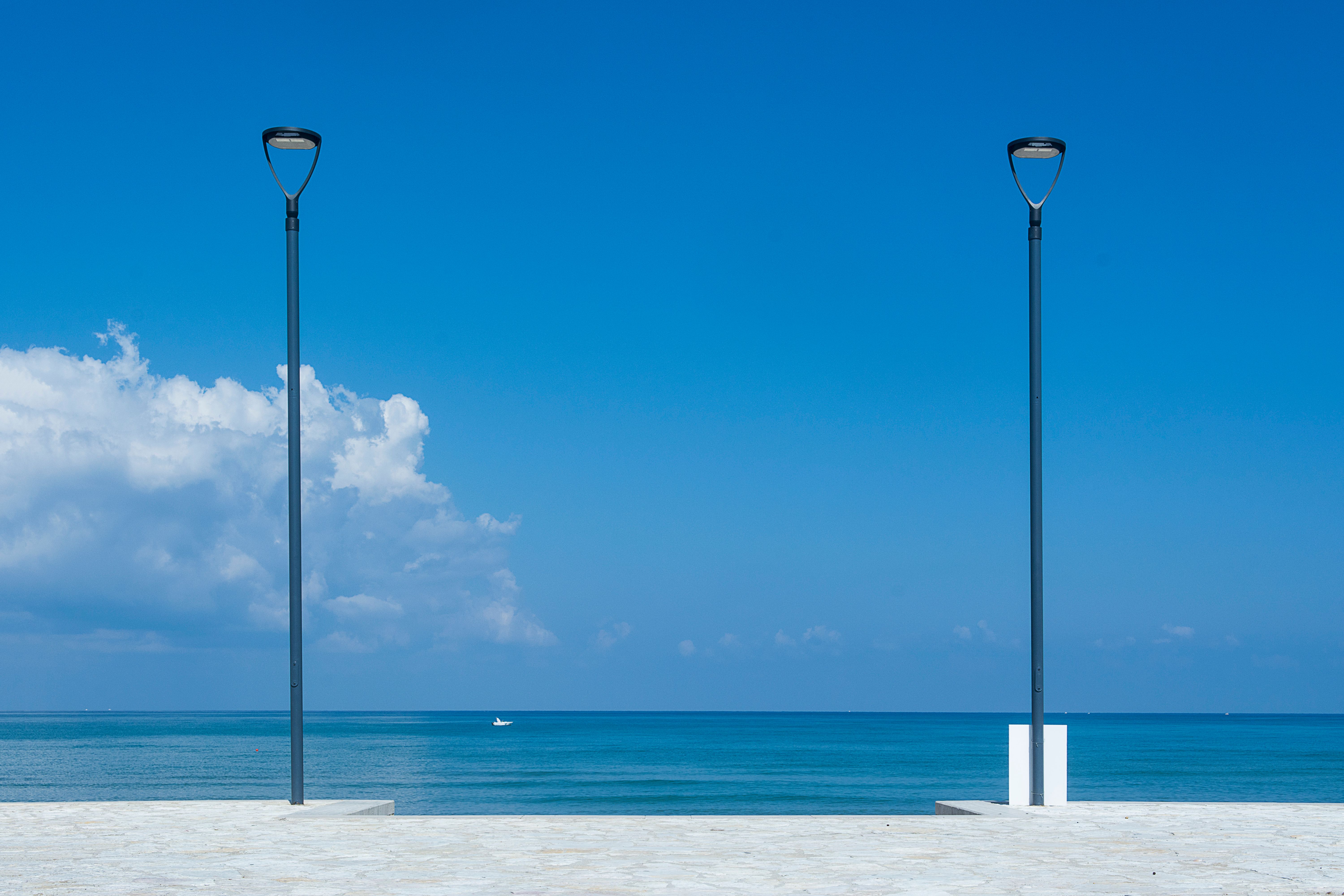 Lamp Posts on a Sea Waterfront · Free Stock Photo