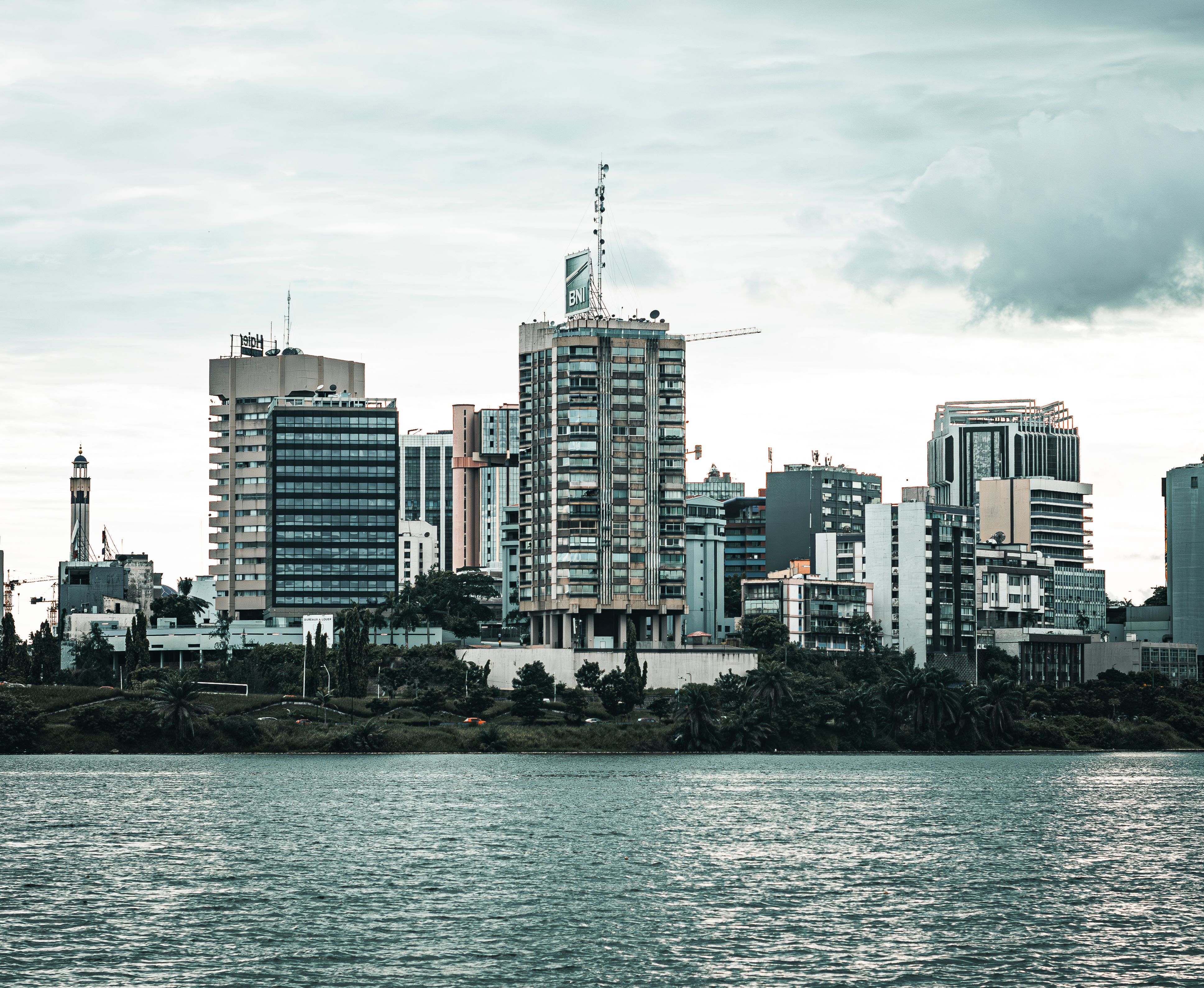 Residential Buildings by Water in City · Free Stock Photo