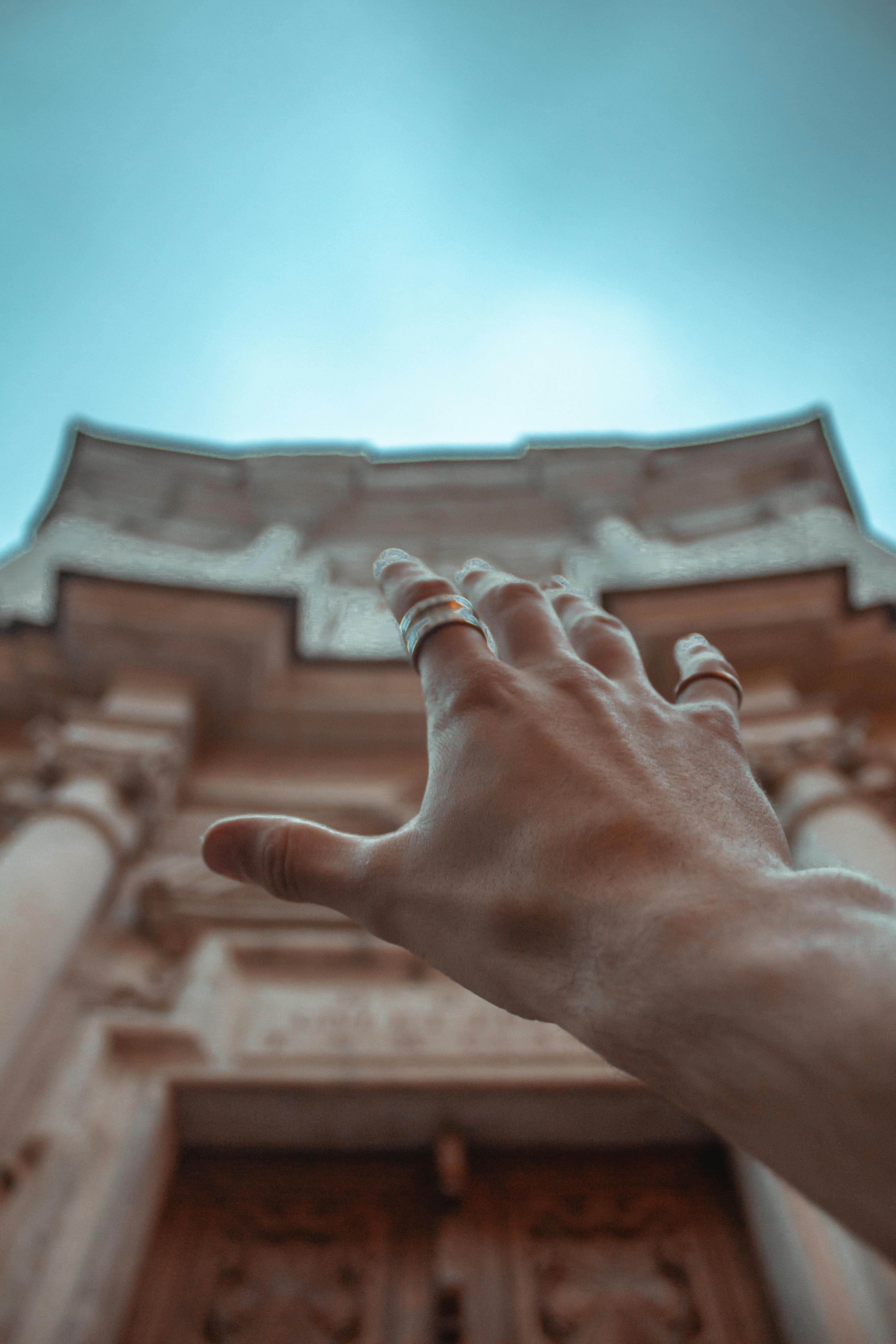 Close-Up Photo of Person Raising His Right Hand · Free Stock Photo
