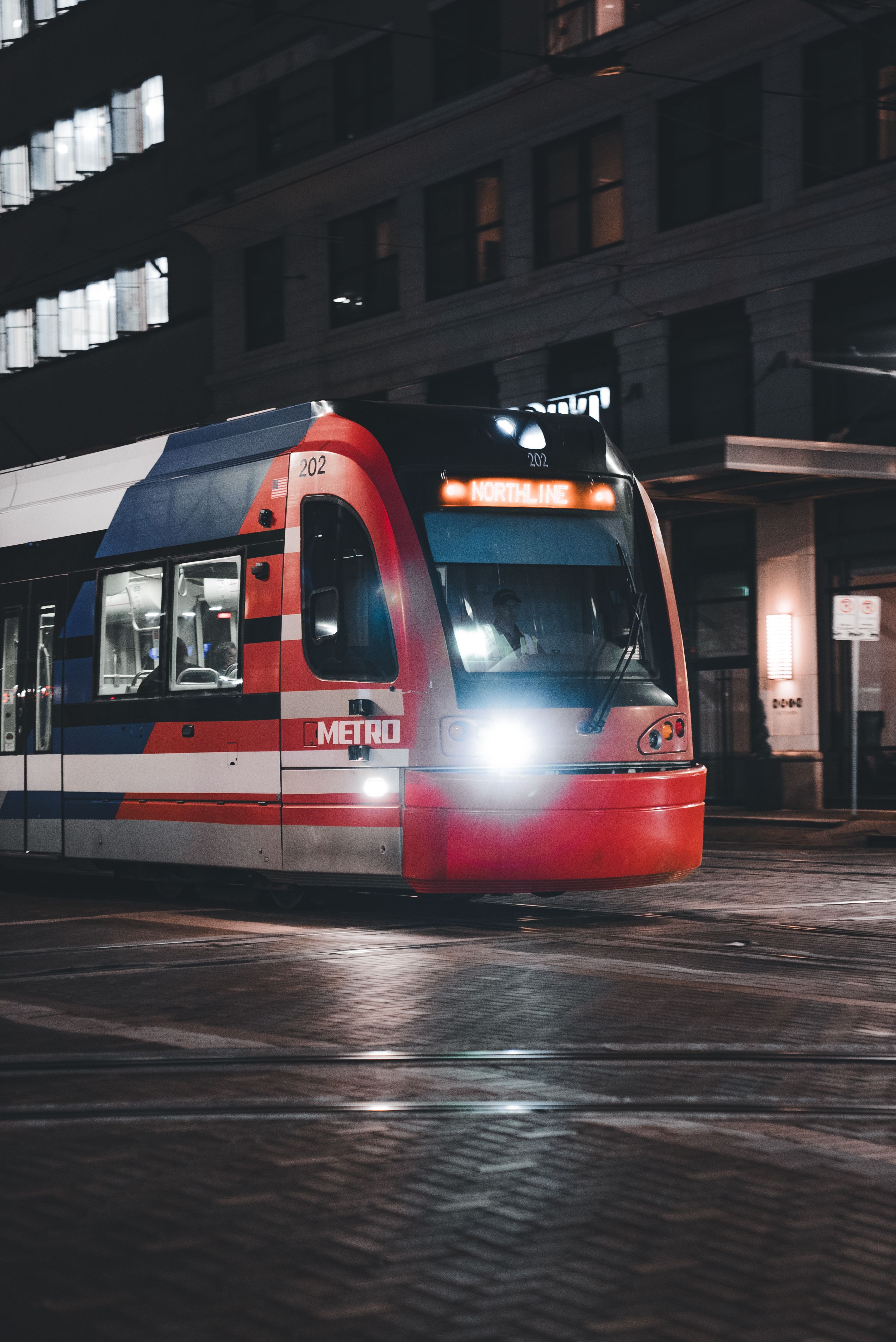 Houston Metro Train Riding on a Night Street · Free Stock Photo