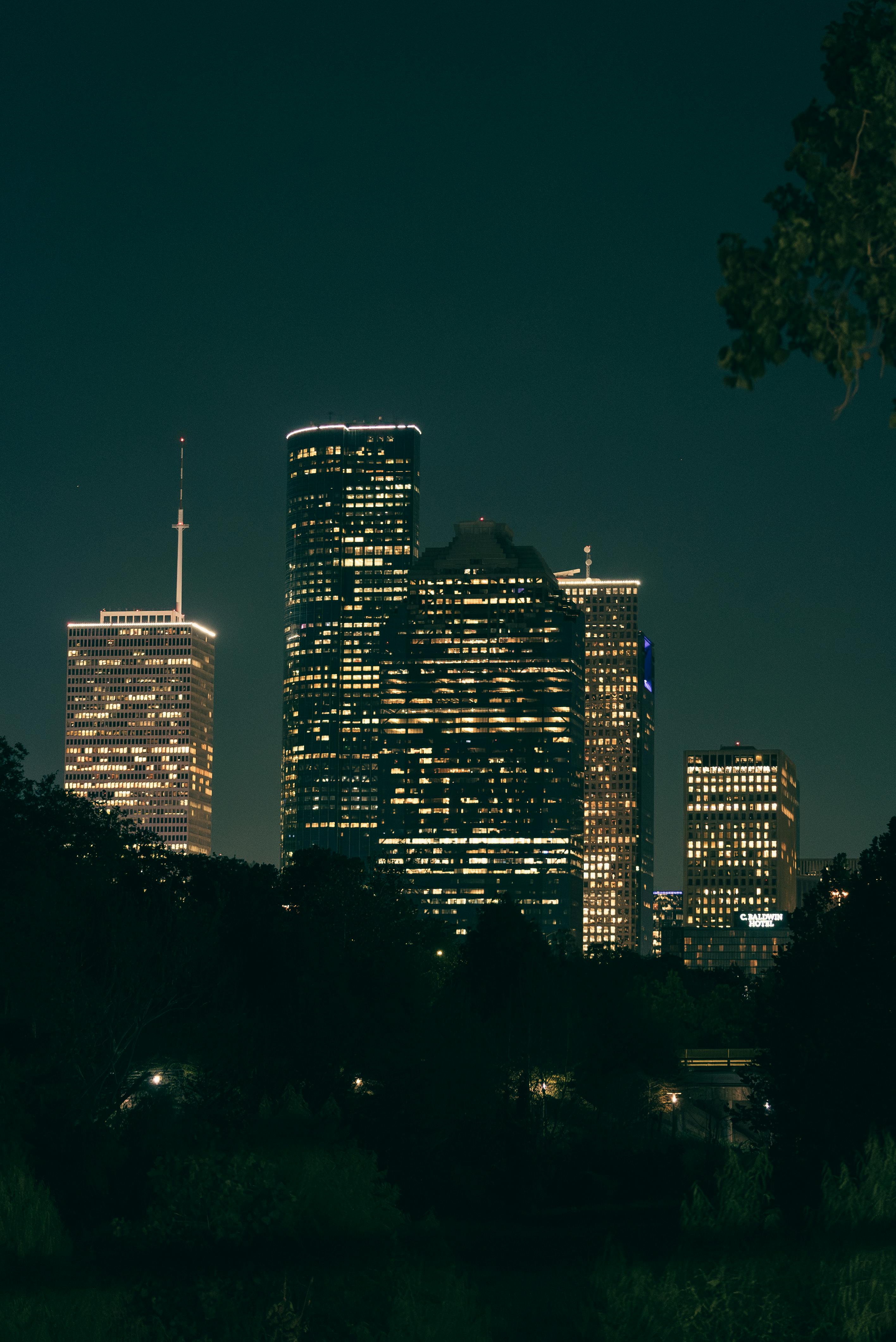 Mid and High Rise Buildings With Lights Turned on during Night · Free ...