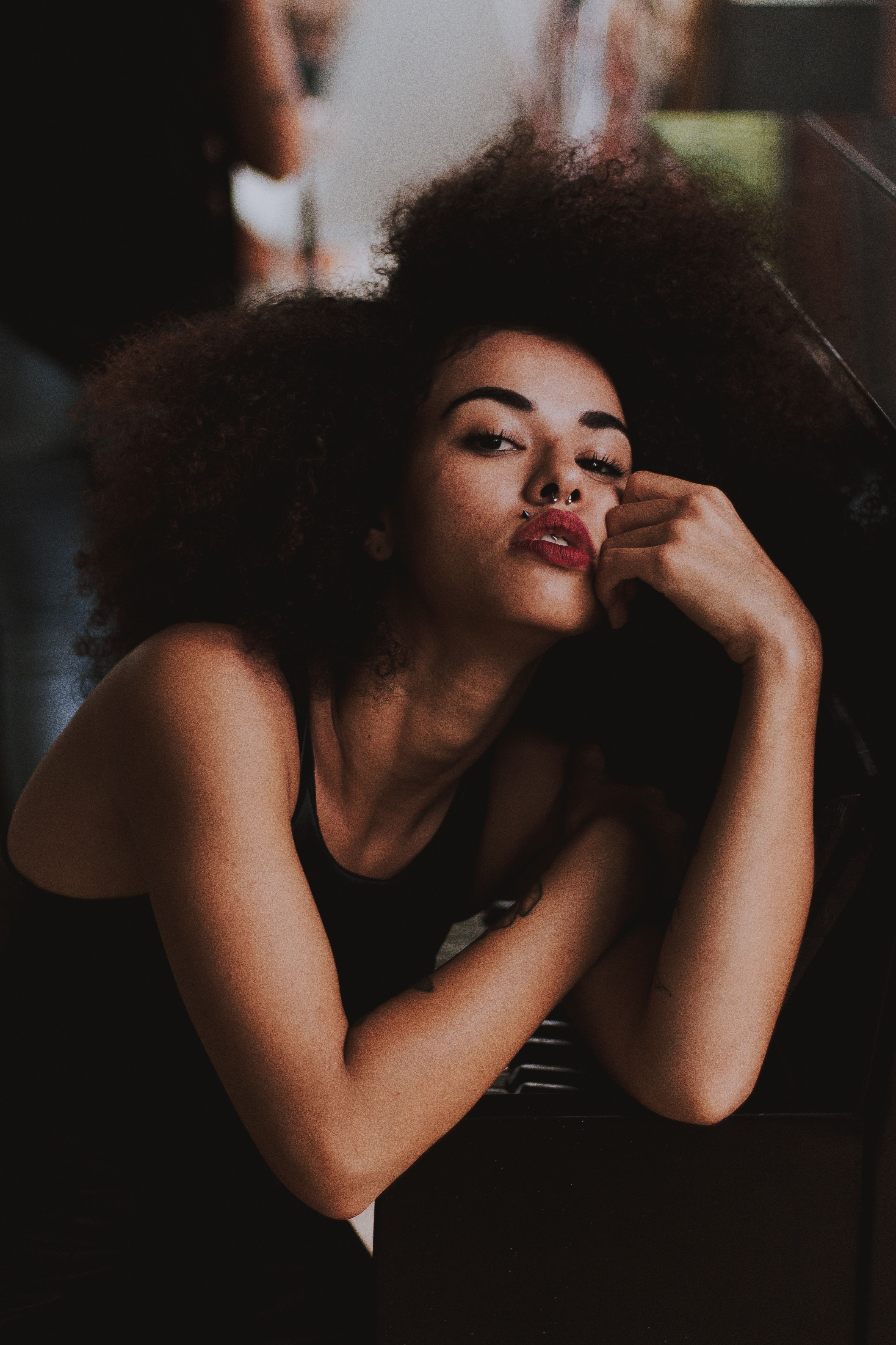 Woman Resting Arm on Piano · Free Stock Photo