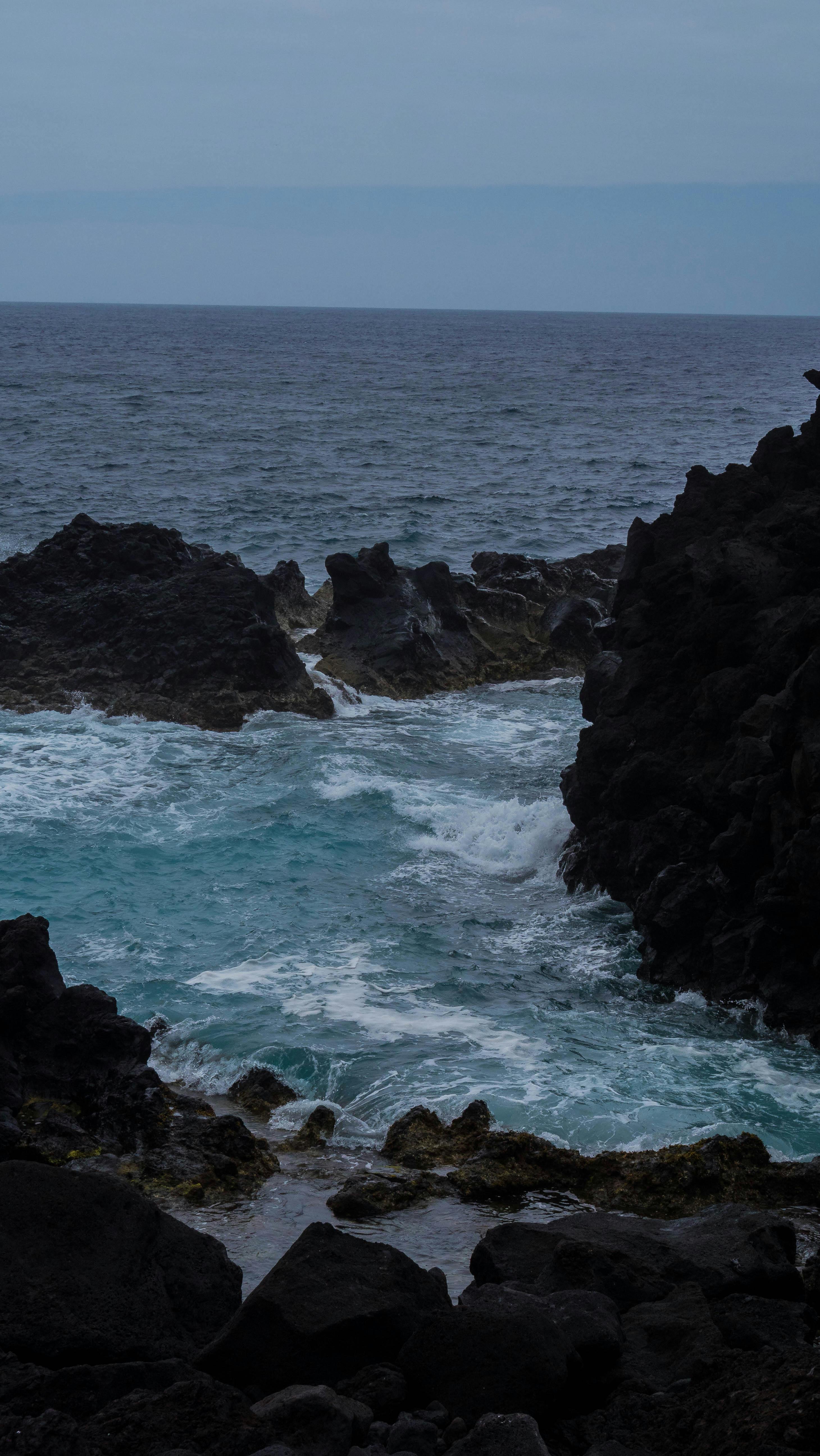 Dark Rocks on the Seashore · Free Stock Photo