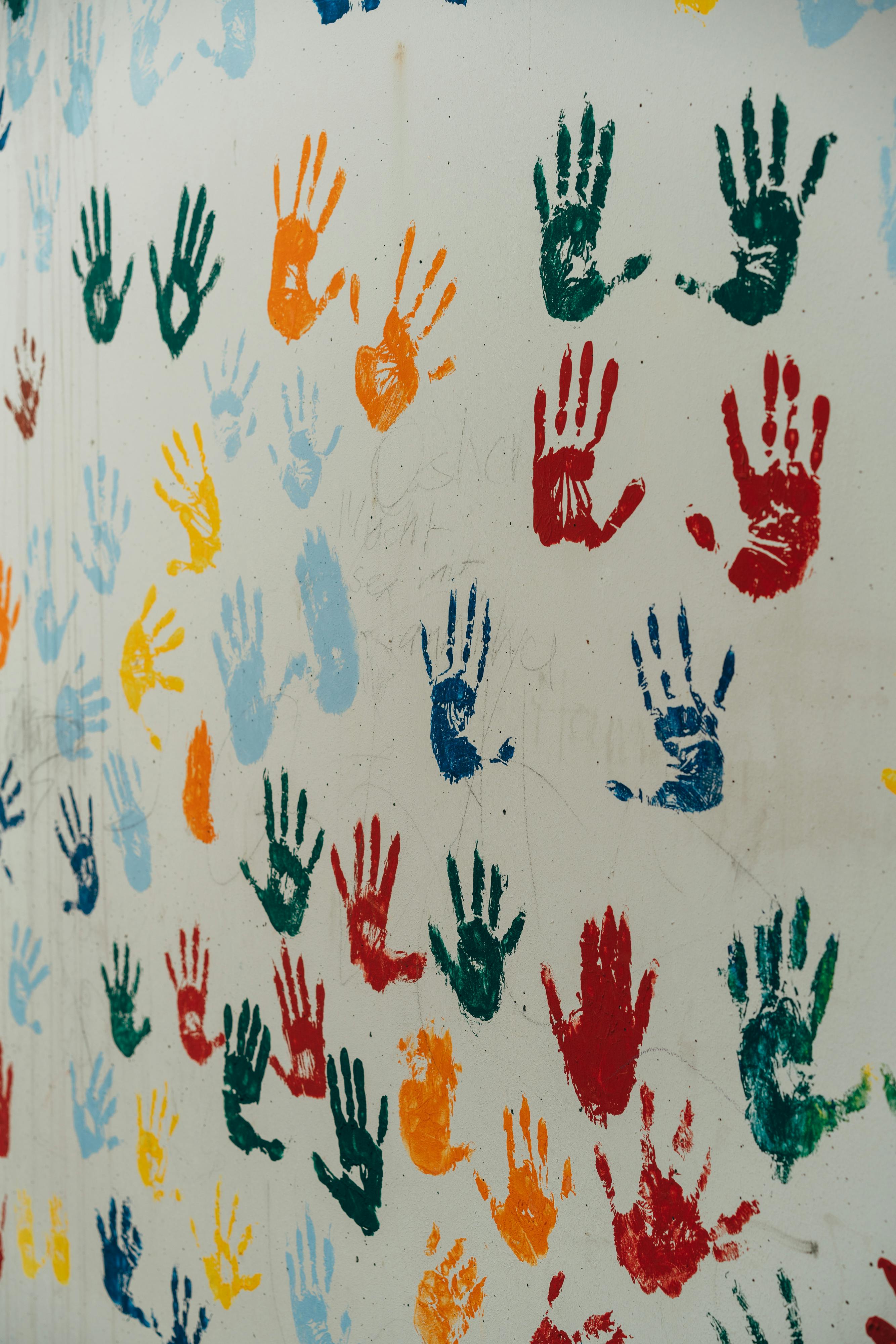 A wall with many hand prints on it · Free Stock Photo