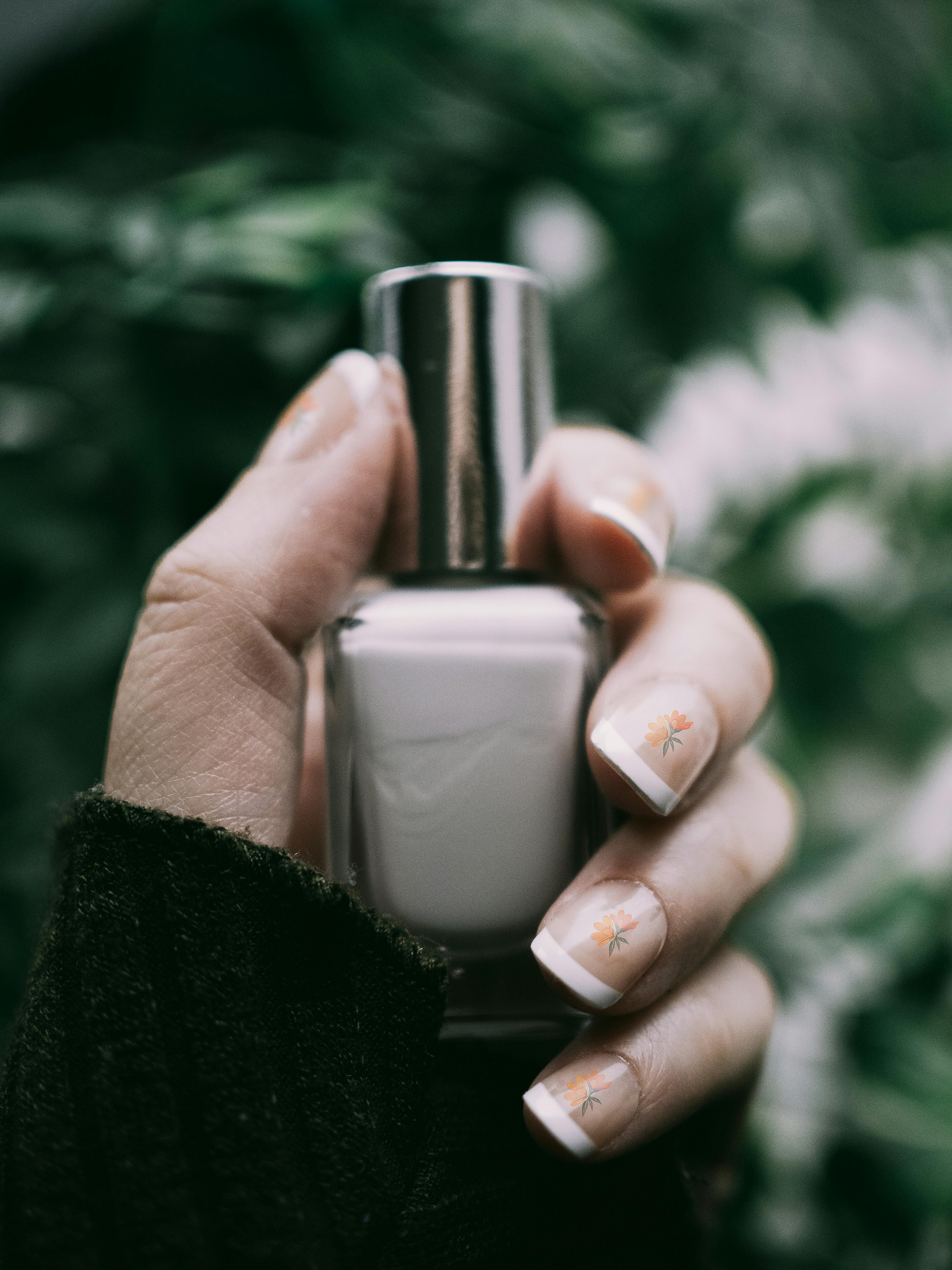 Woman Hand Holding Vial of Nail Polish · Free Stock Photo