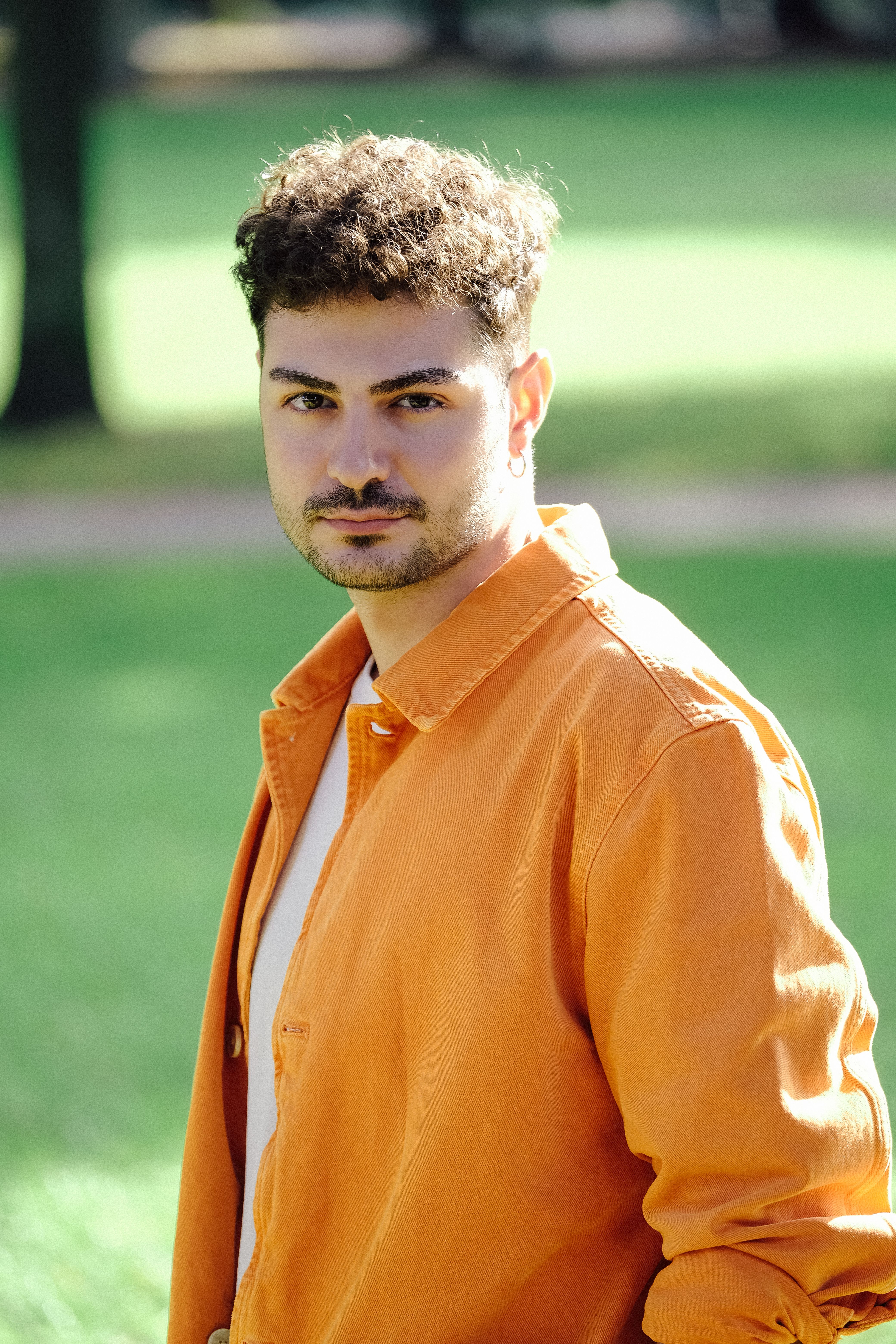 Portrait of Man in Orange Shirt · Free Stock Photo