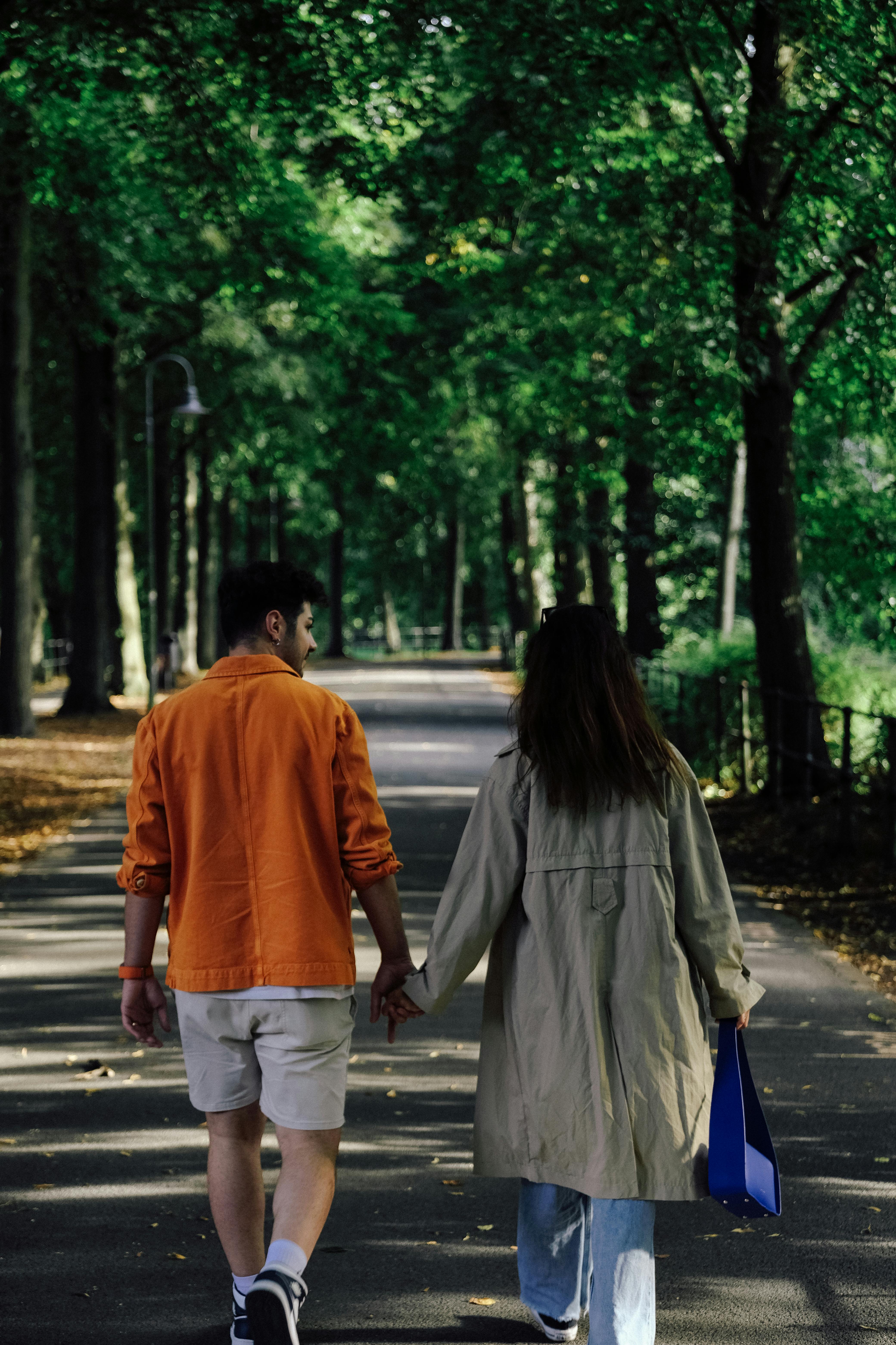 Couple Walking Together and Holding Hands · Free Stock Photo