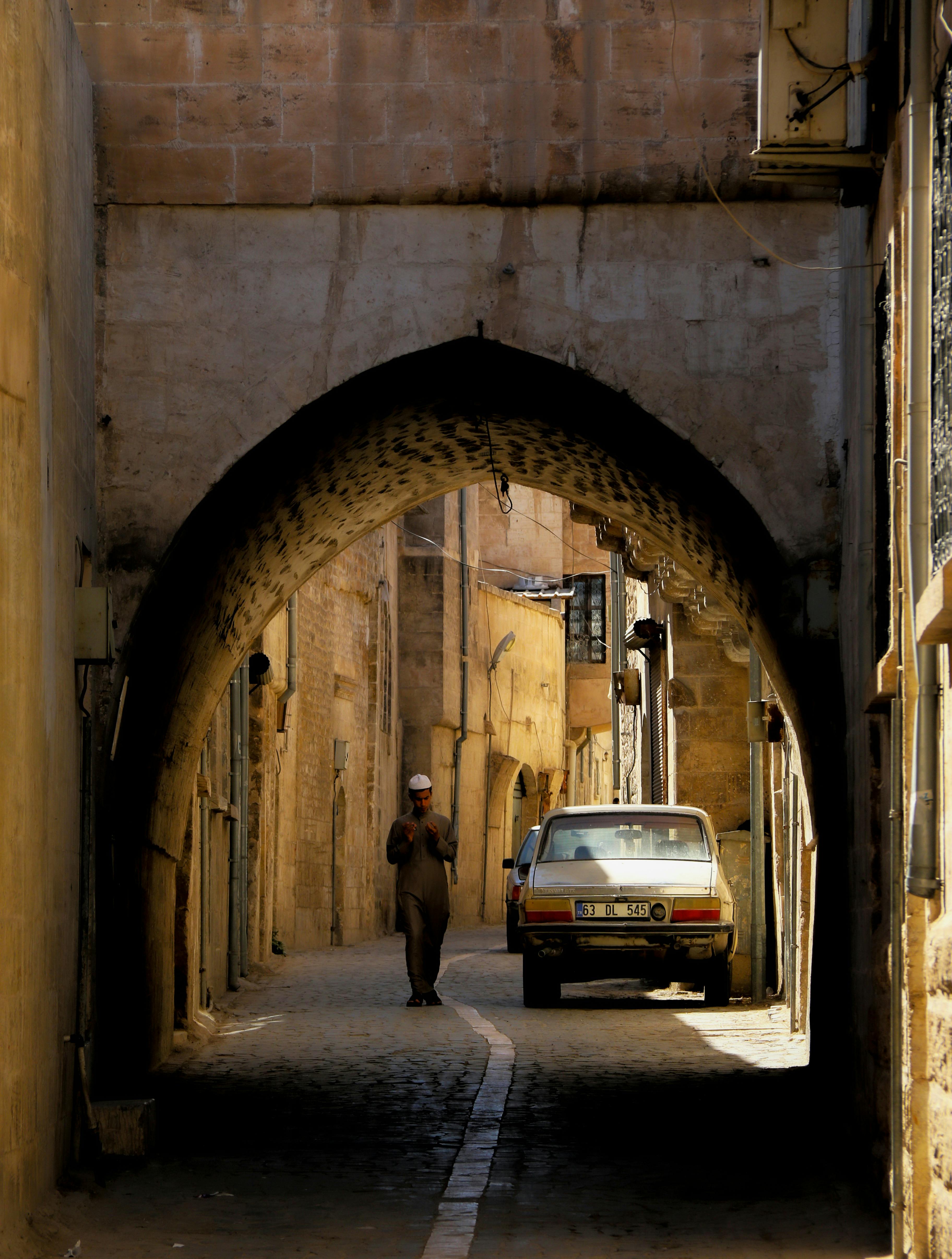 Man Standing by Car in Alley in Urfa, Turkey · Free Stock Photo
