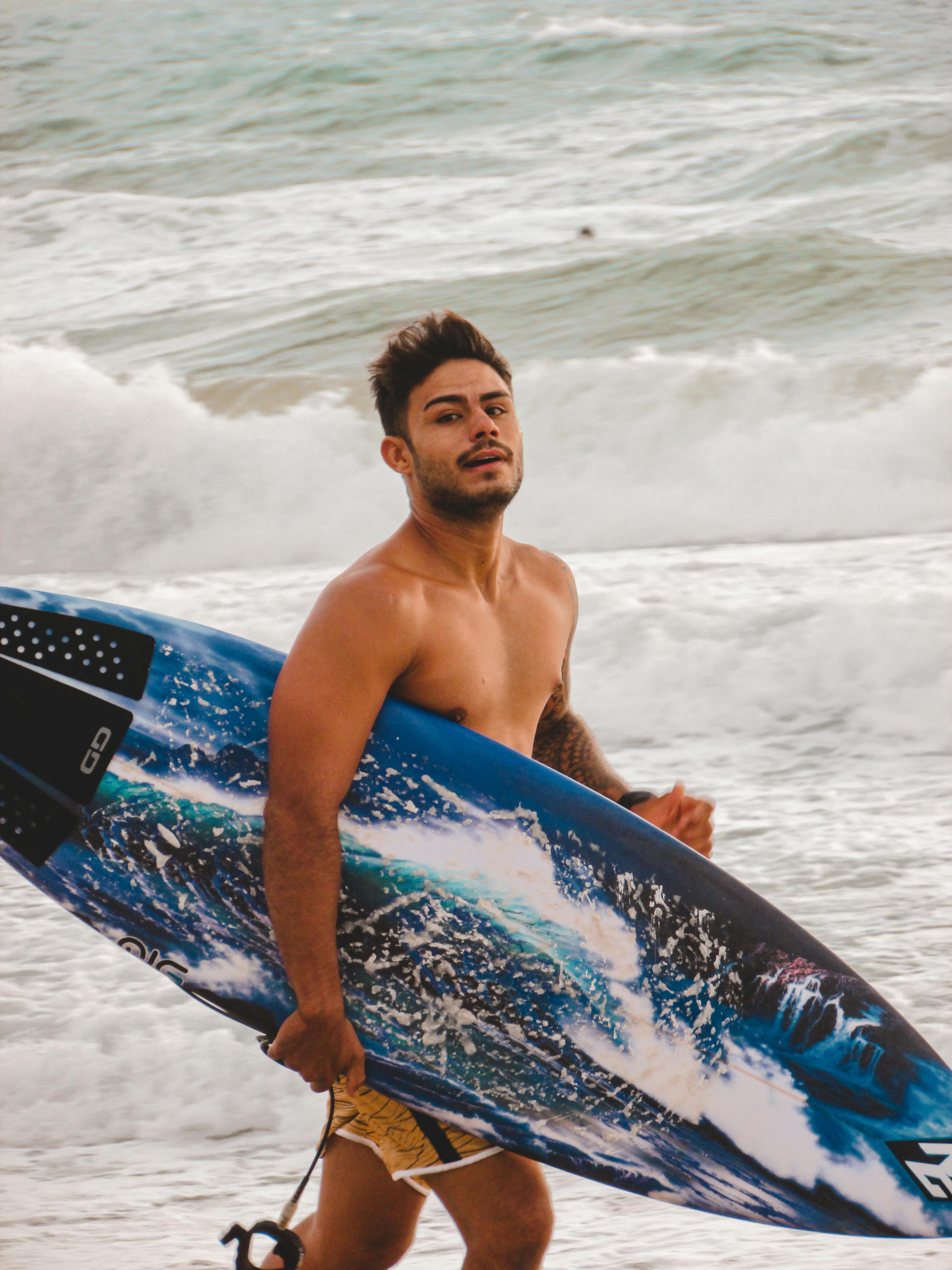 Handsome Surfer on Beach · Free Stock Photo