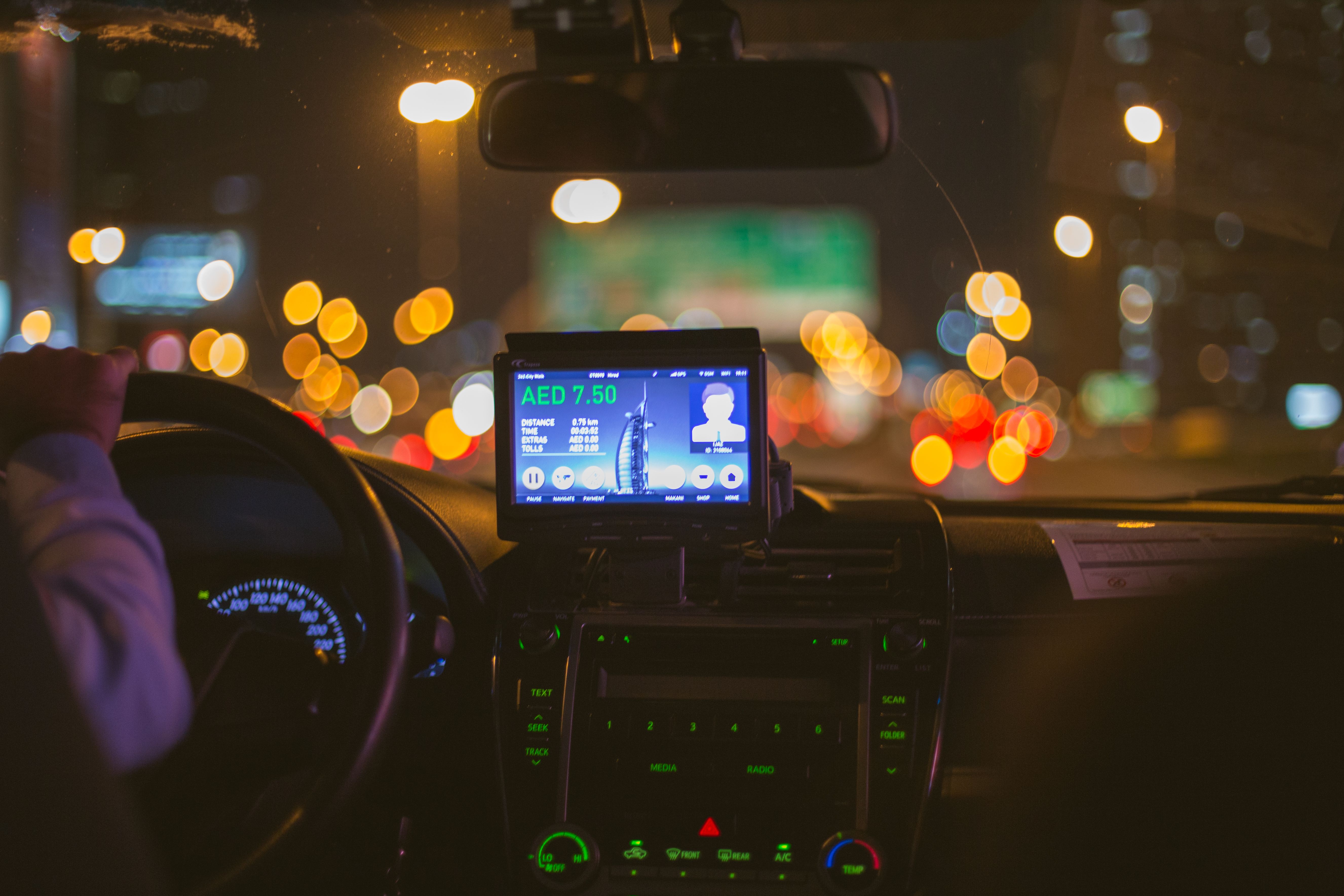 Taxi Ride Price Displayed on Screen on Dashabord in Car · Free Stock Photo