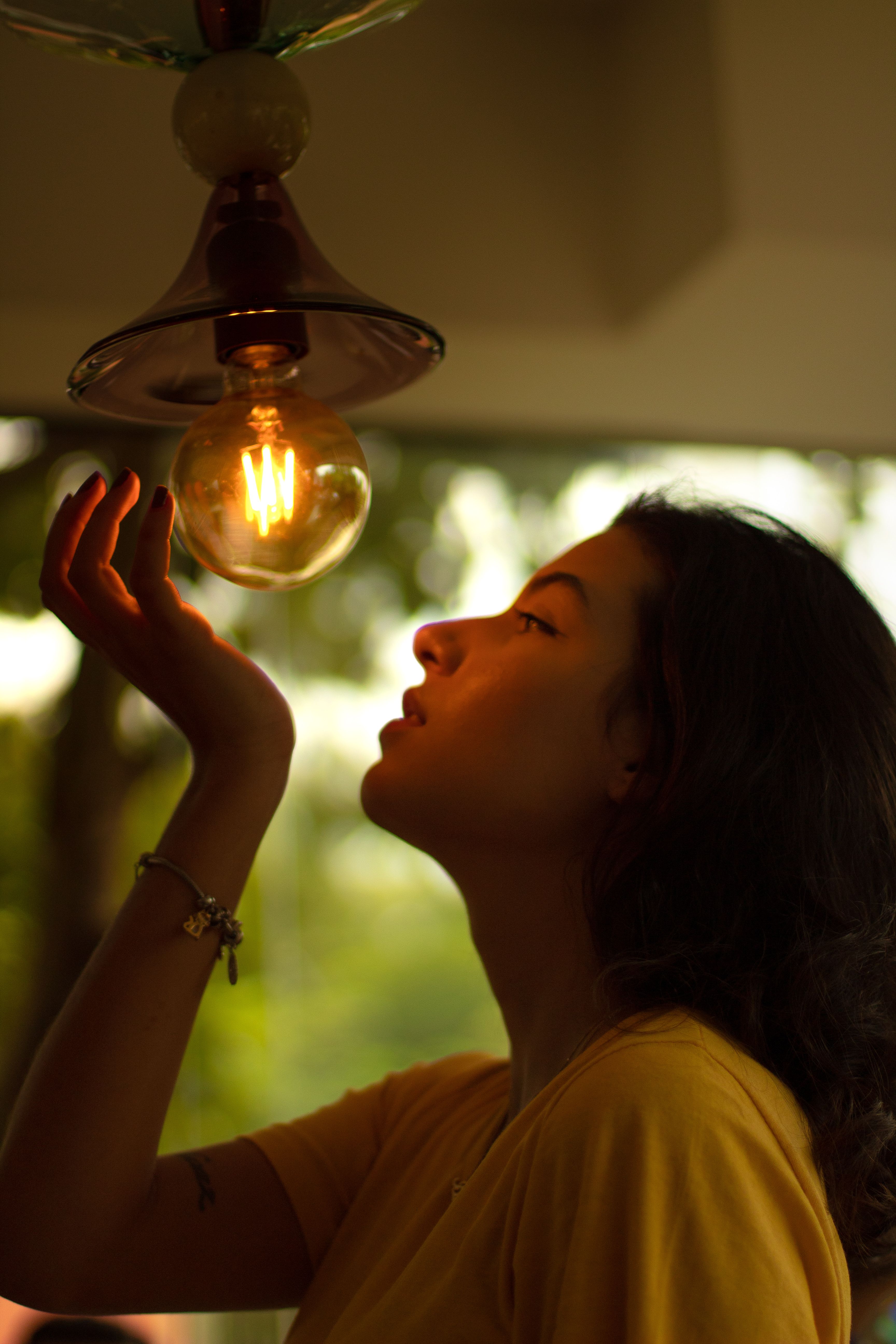 Woman Holding Light Bulb · Free Stock Photo