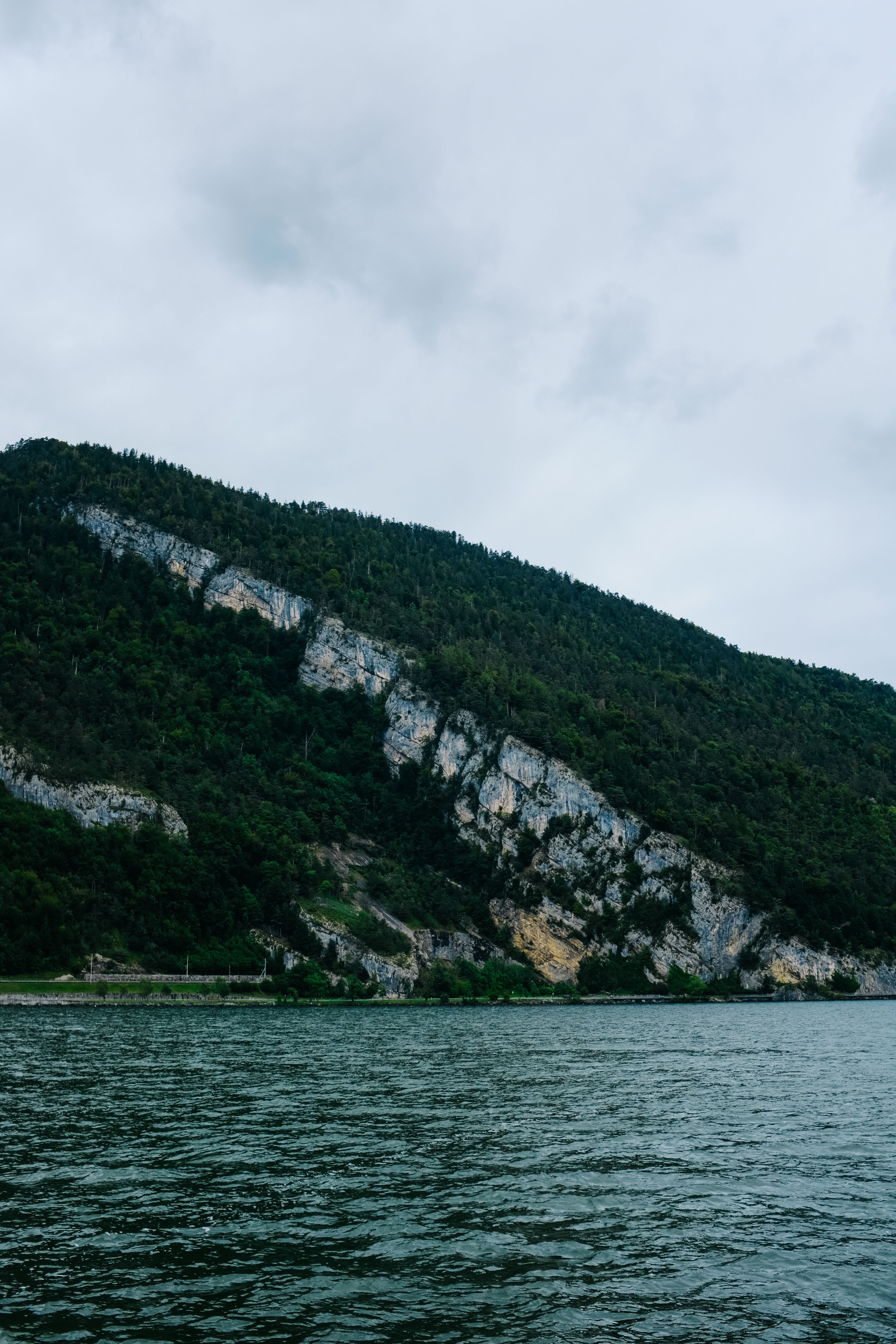 White Cliffs on Hillside by Lake Shore · Free Stock Photo